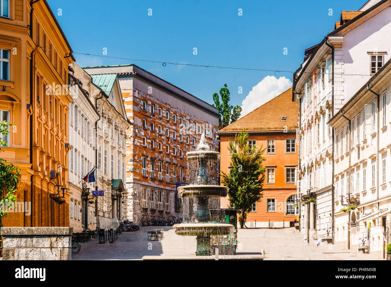 Building and fountain next to fountain novi trg square in Ljubljana ...