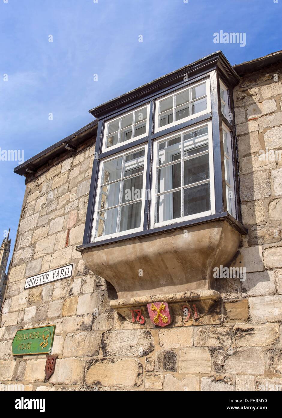 Historic building at Minster Yard with an ancient bay window. There are ...