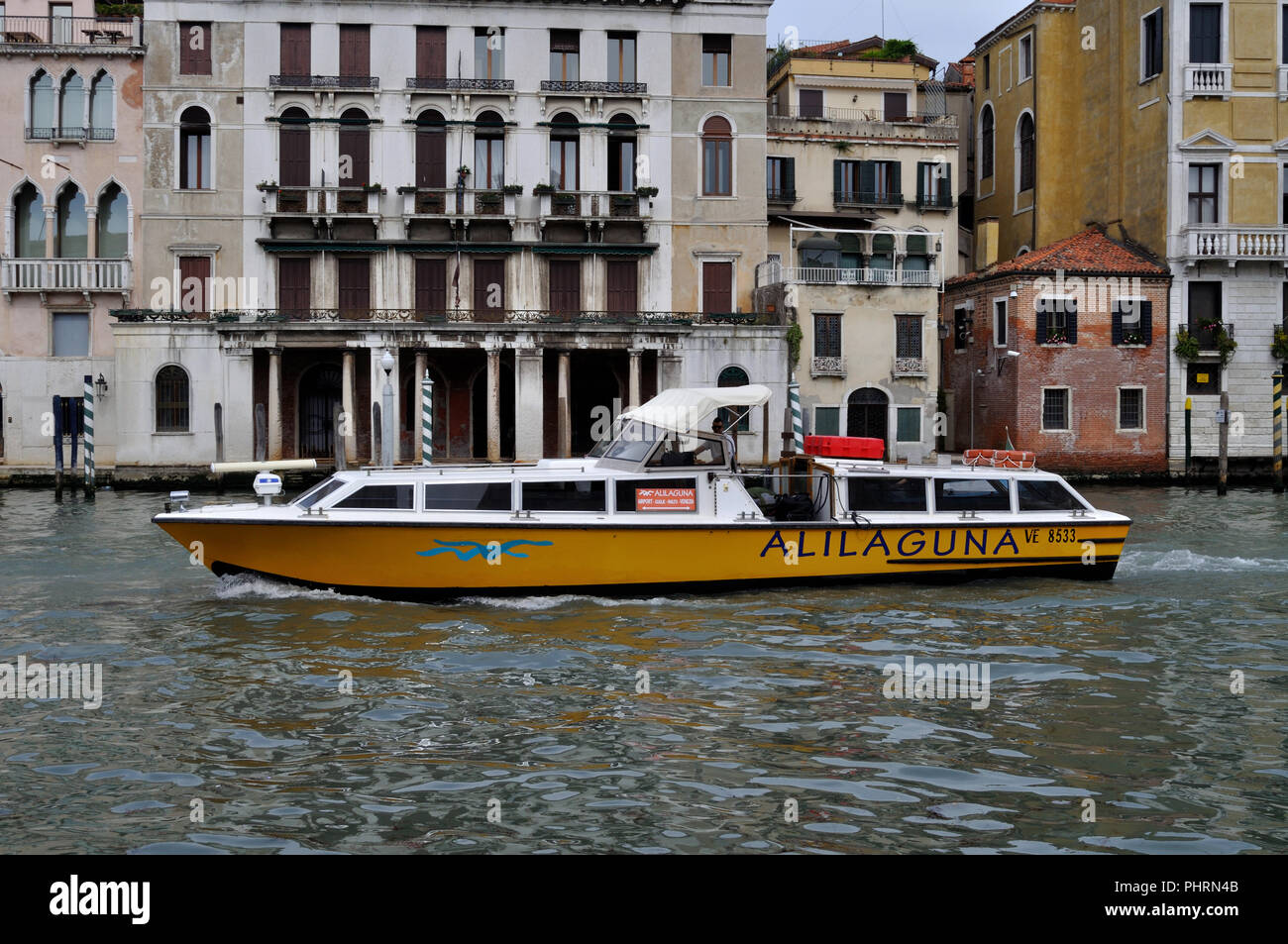 An Alilaguna boat linking Venice Airport with the city navigates the ...