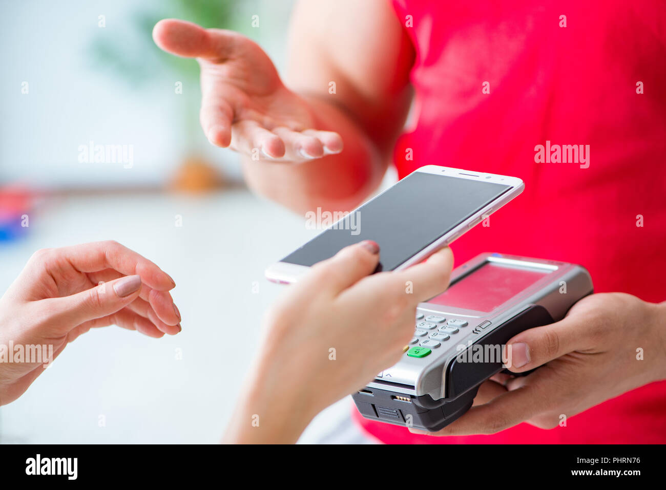 Concept of paying with POS terminal Stock Photo - Alamy