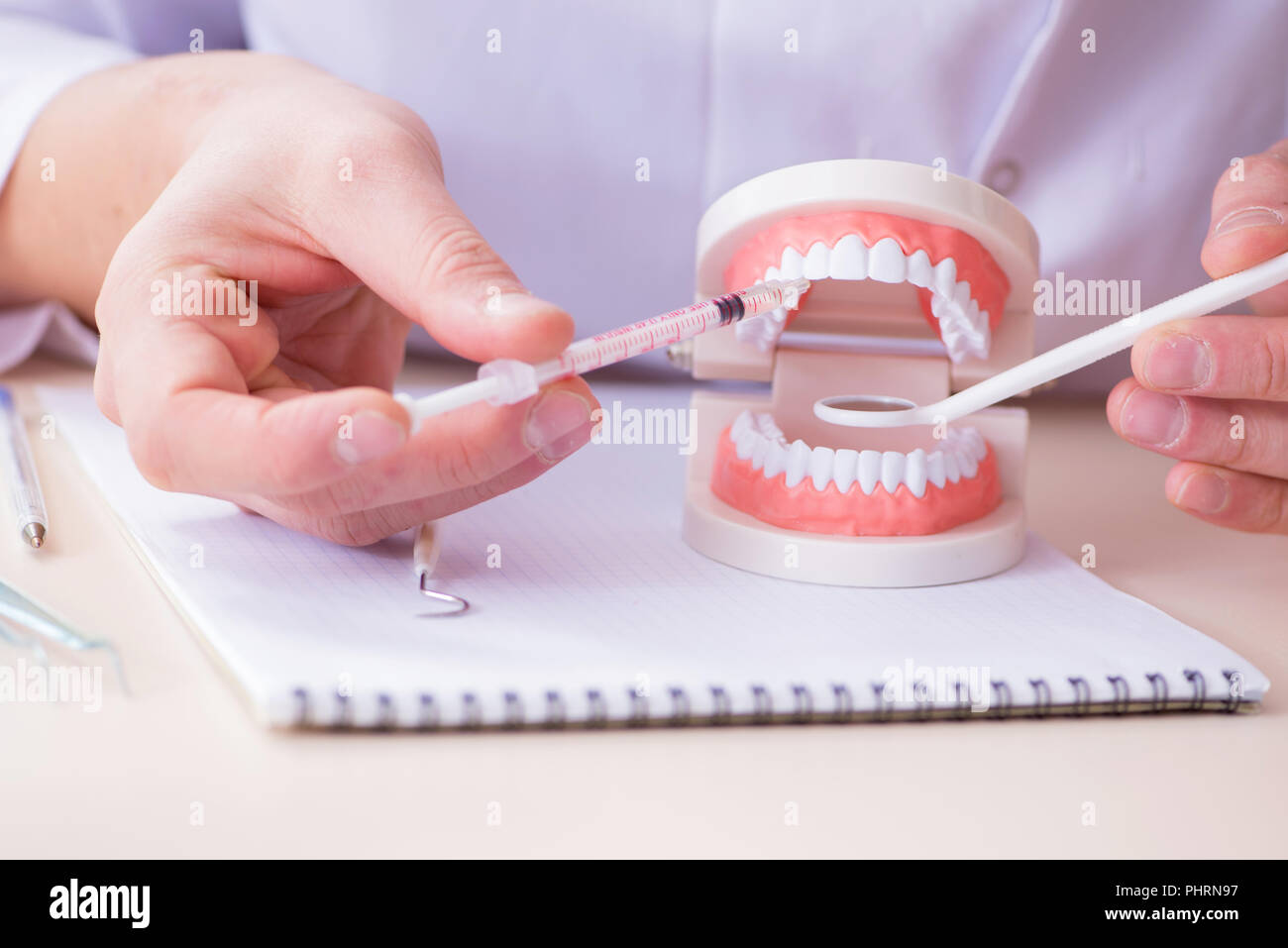Dentist working teeth implant in medical lab Stock Photo - Alamy