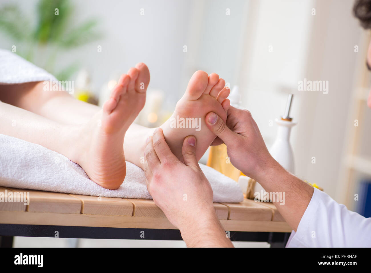 Foot massage in medical spa Stock Photo - Alamy