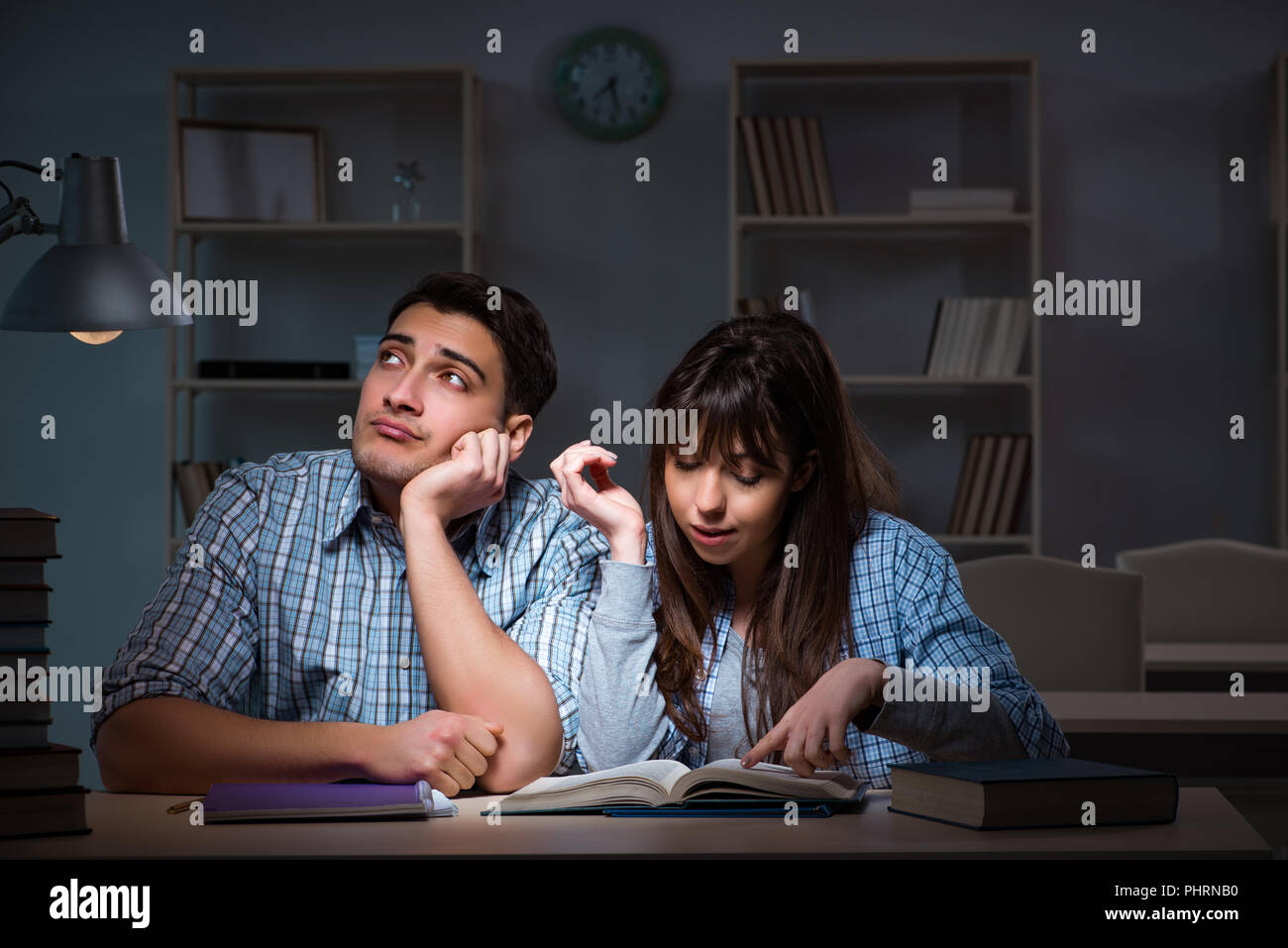 Two students studying late at night Stock Photo - Alamy