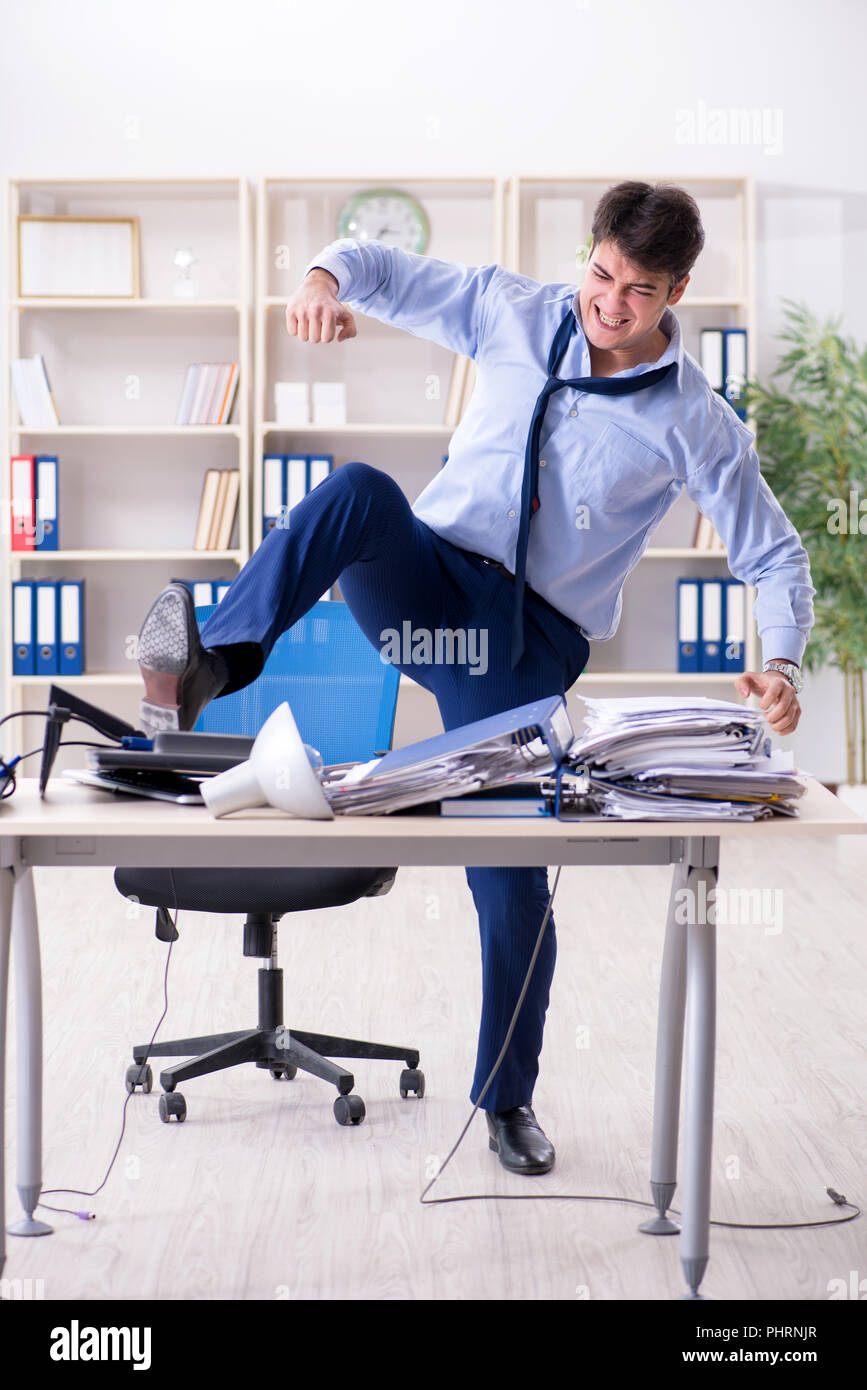 Angry businessman frustrated with too much work Stock Photo - Alamy