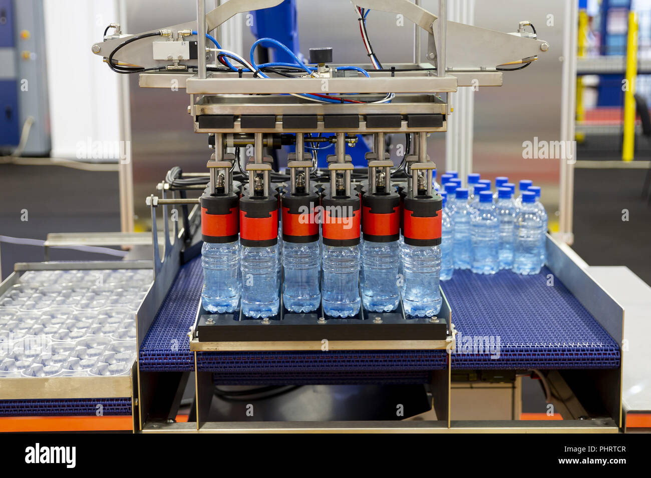 Robotic arm water bottles Stock Photo - Alamy