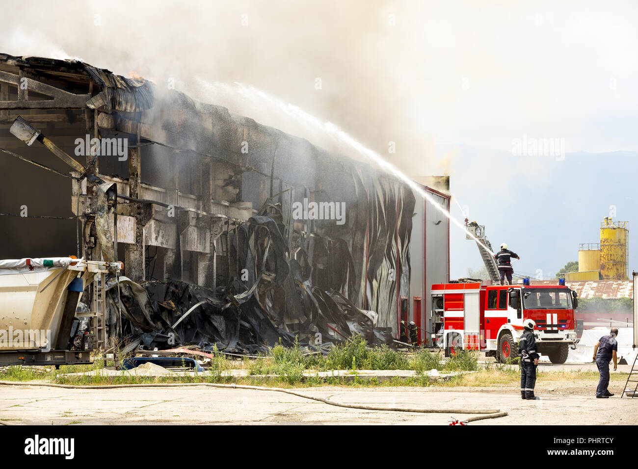 Large fire disaster in a warehouse Stock Photo - Alamy