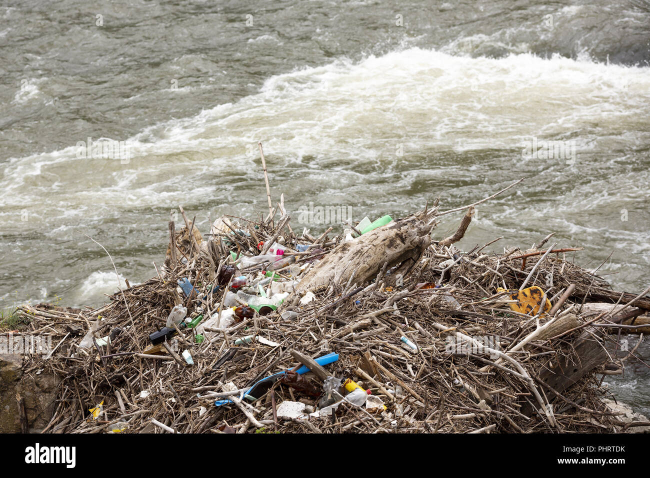 Trash on the river Stock Photo - Alamy