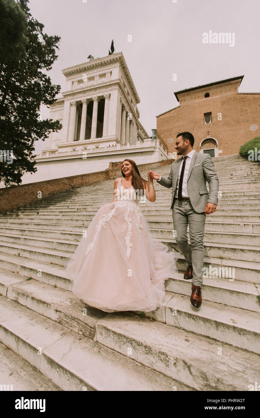 Wedding couple on stairs of Cordonata Capitolina in Rome, Italy Stock ...