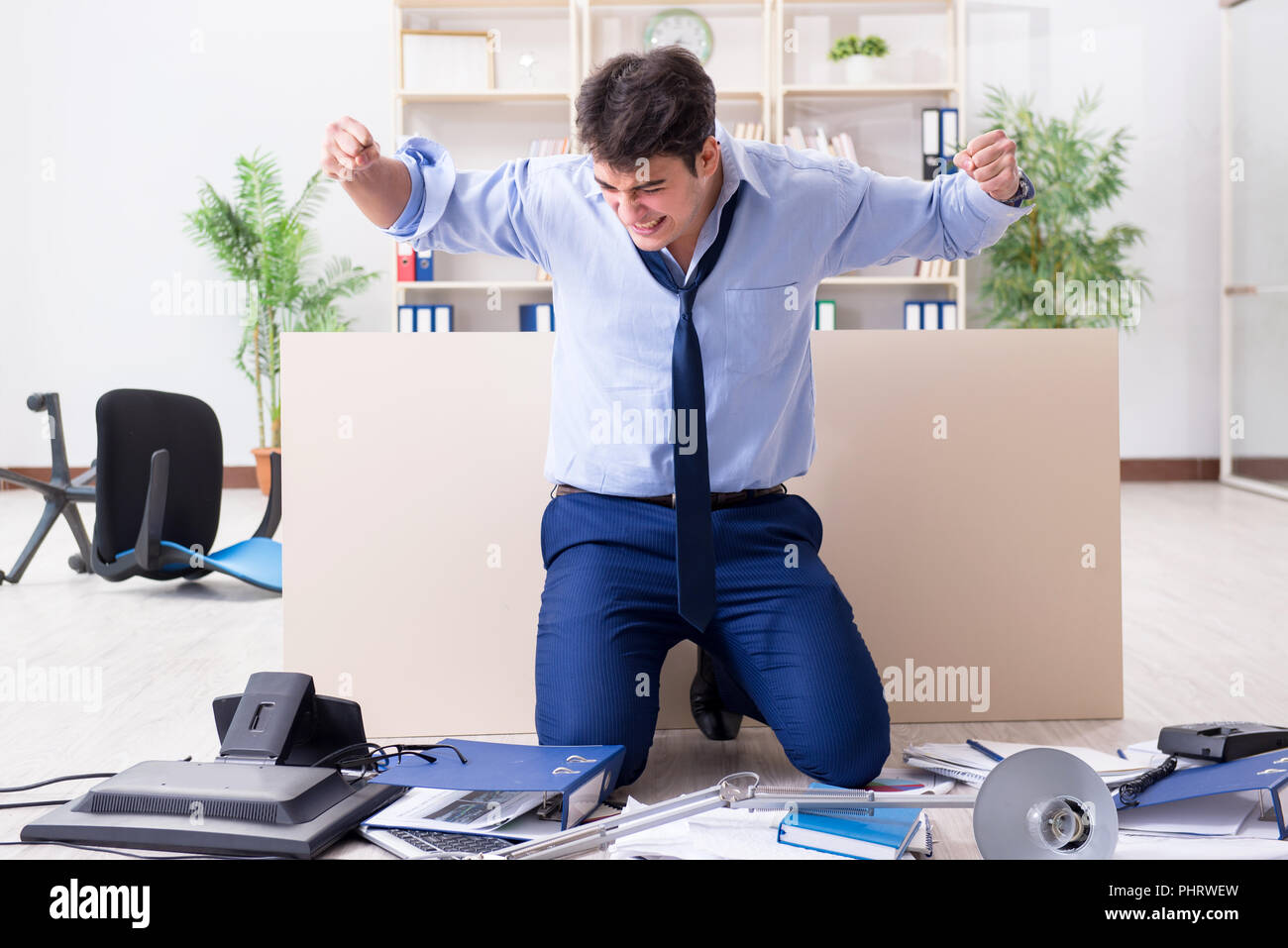 Angry businessman frustrated with too much work Stock Photo - Alamy