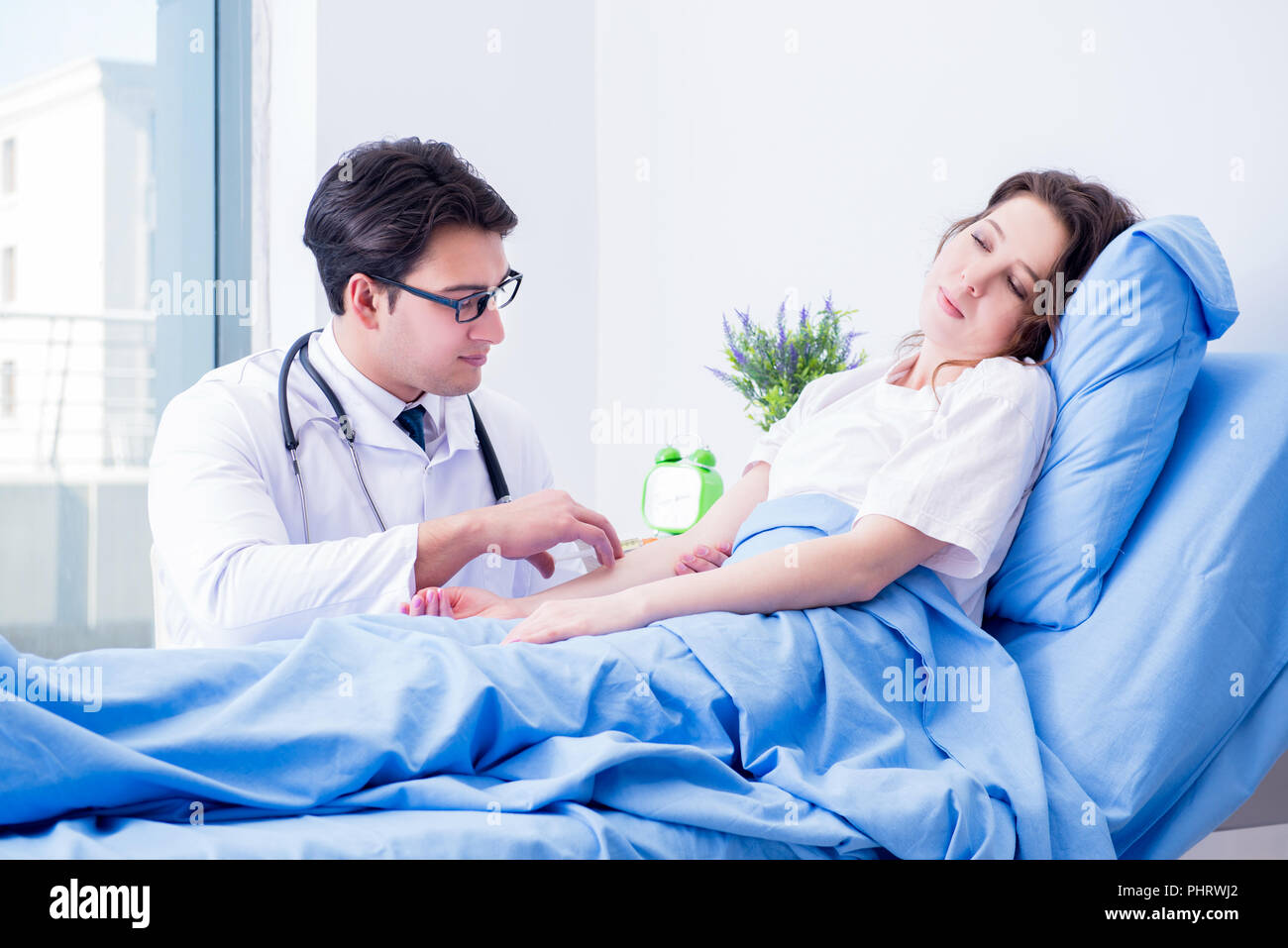 Doctor doing medical injection in hospital room Stock Photo - Alamy
