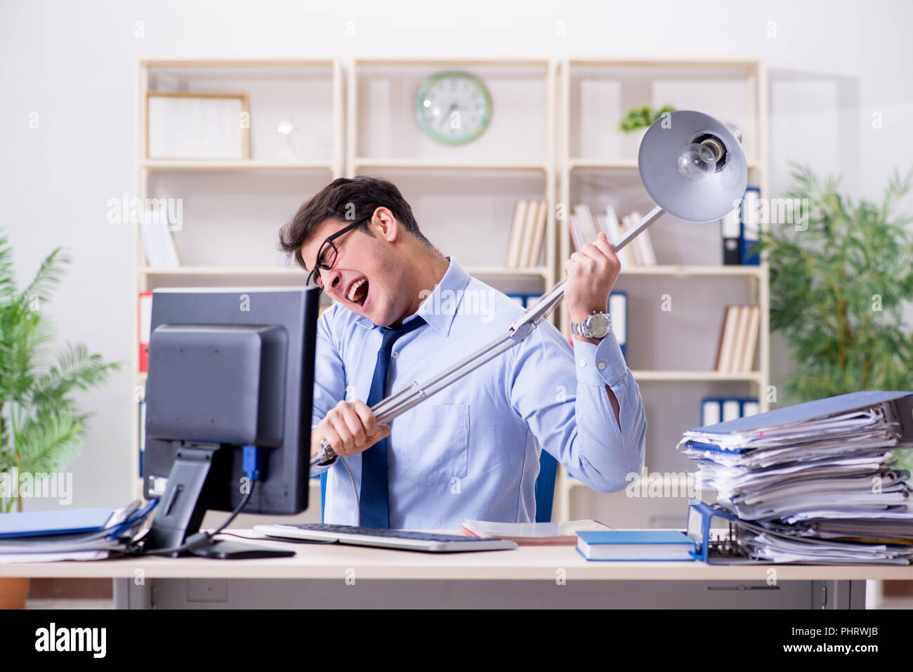 Angry businessman frustrated with too much work Stock Photo - Alamy