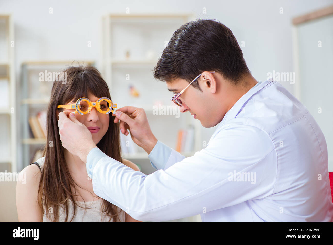 Ophthalmologist is checking up patient in eye doctor hospital Stock ...