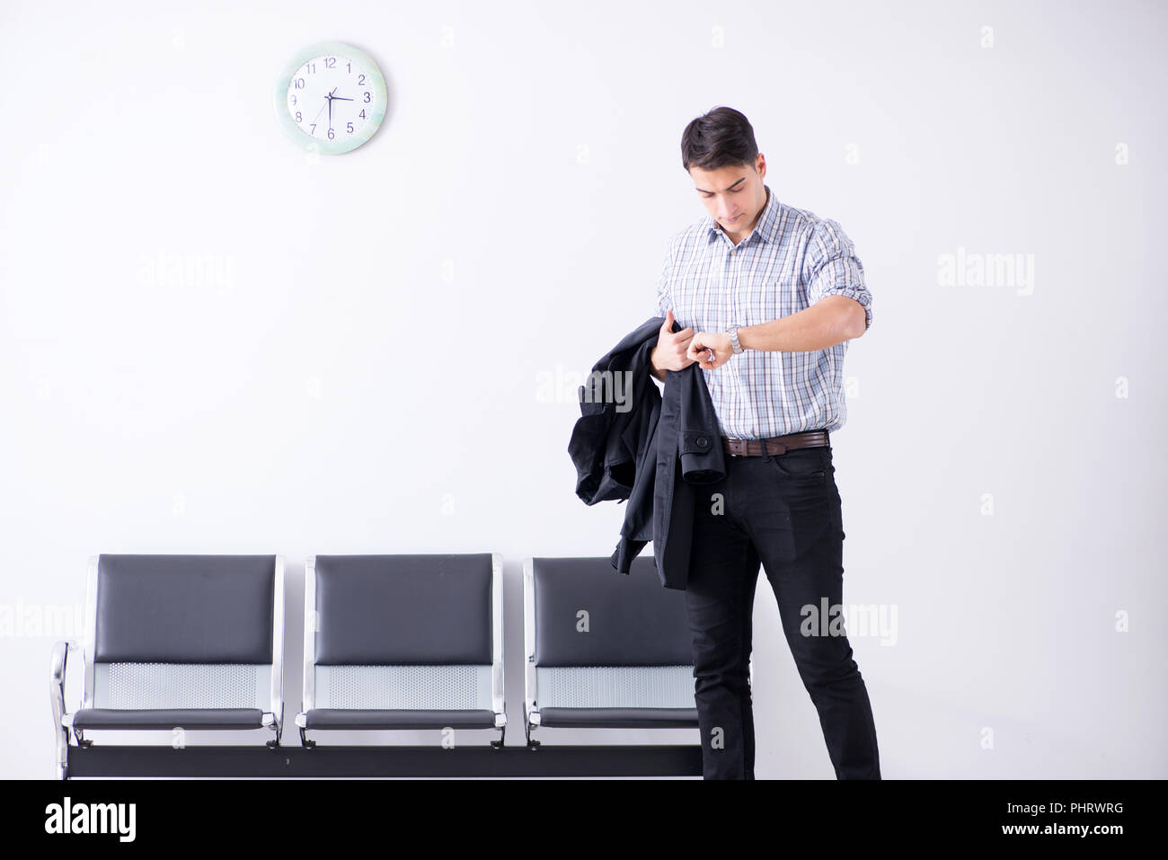 Man nervously impatiently waiting in the lobby Stock Photo - Alamy