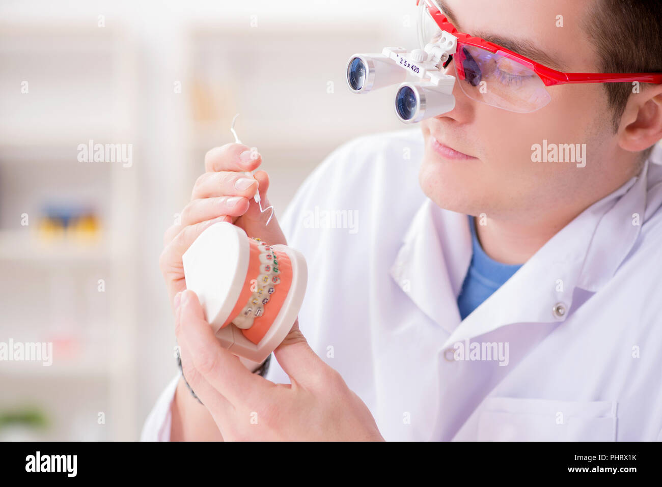 Dentist working teeth implant in medical lab Stock Photo - Alamy
