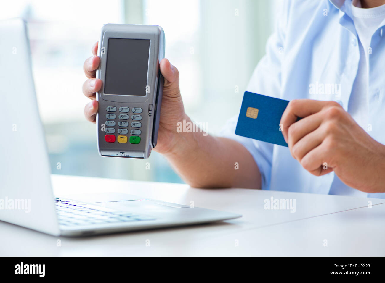 Man processing credit card transaction with POS terminal Stock Photo ...