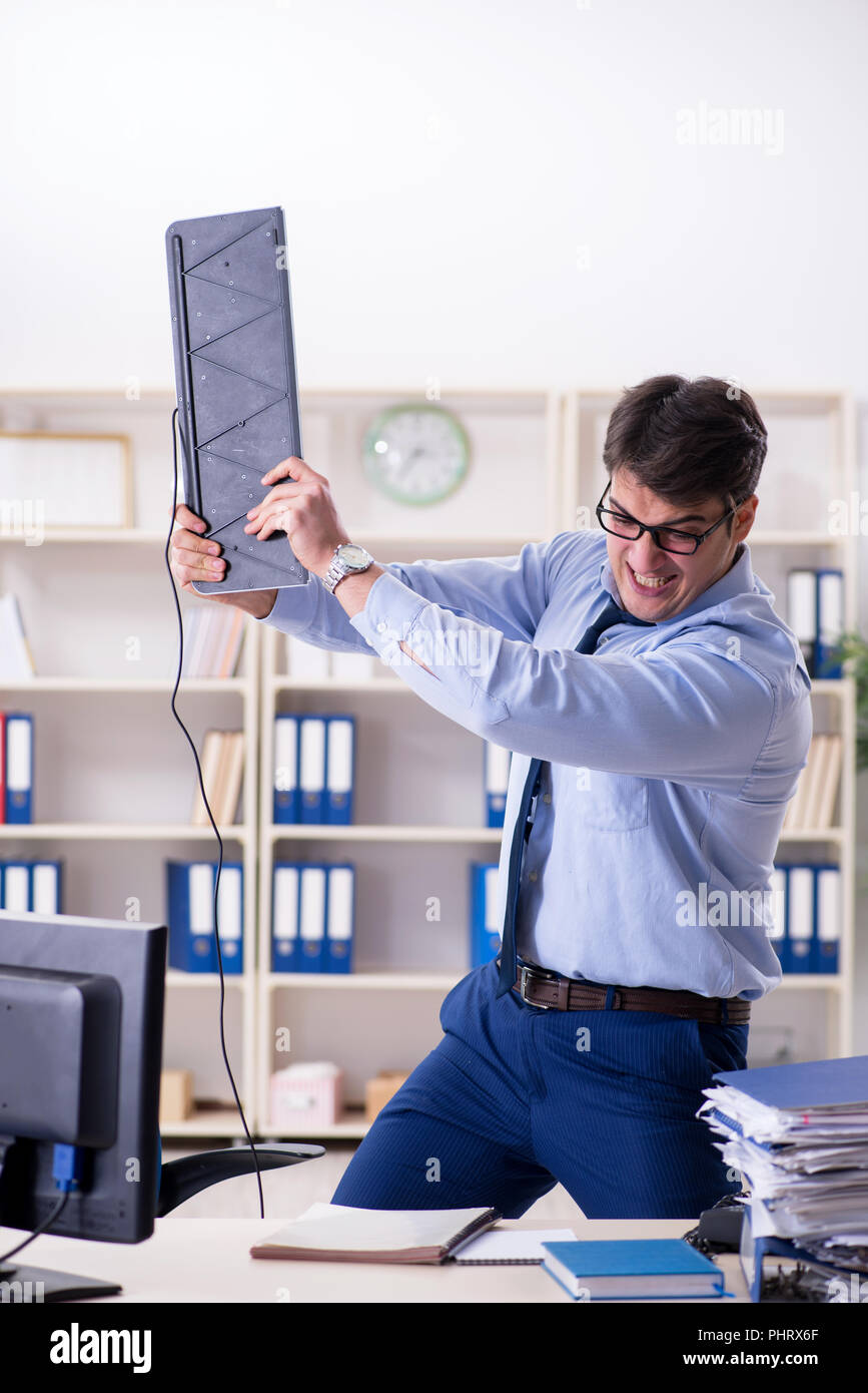 Angry businessman frustrated with too much work Stock Photo - Alamy