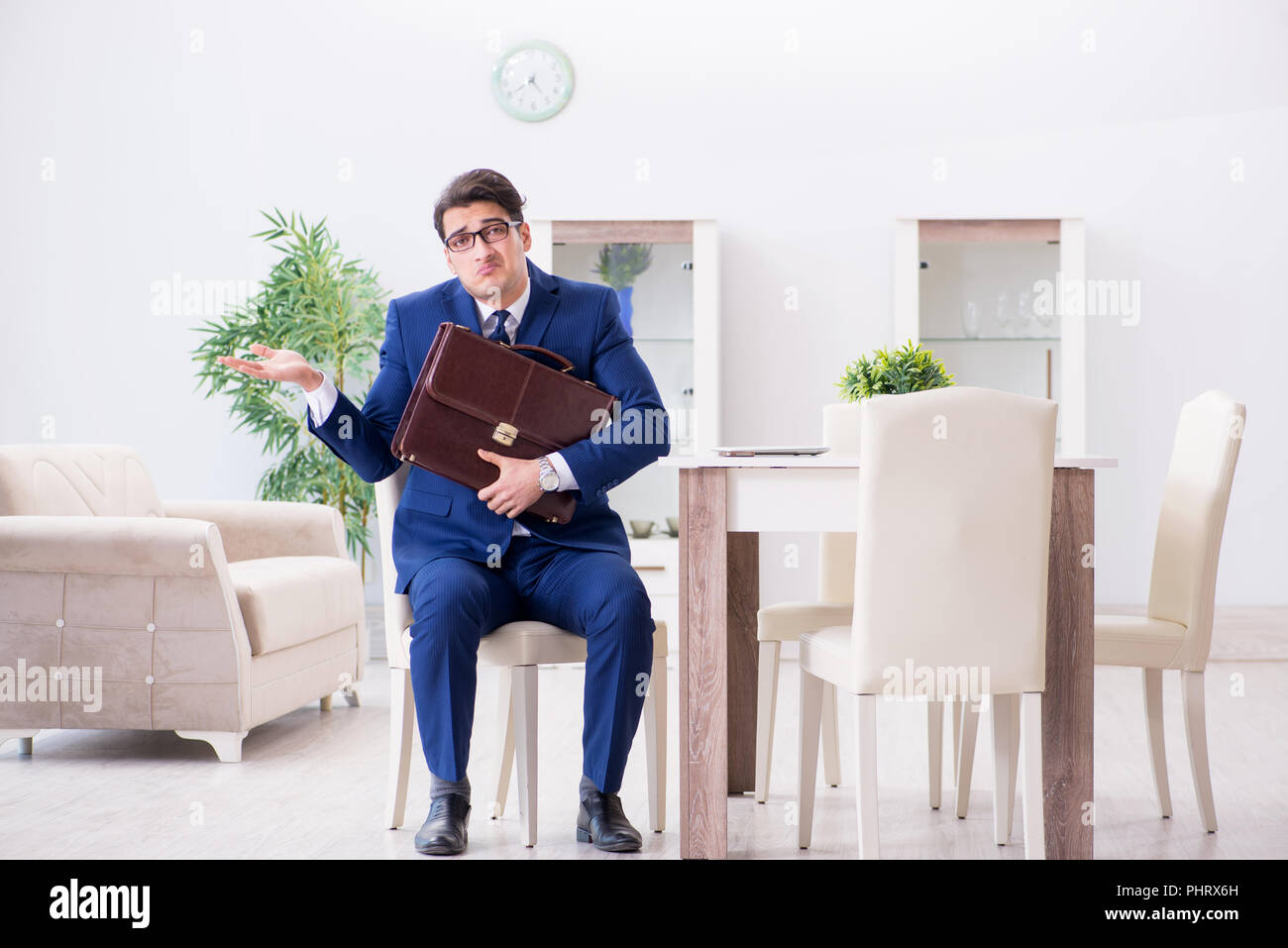 Bankrupt businessman angry and upset at home Stock Photo - Alamy