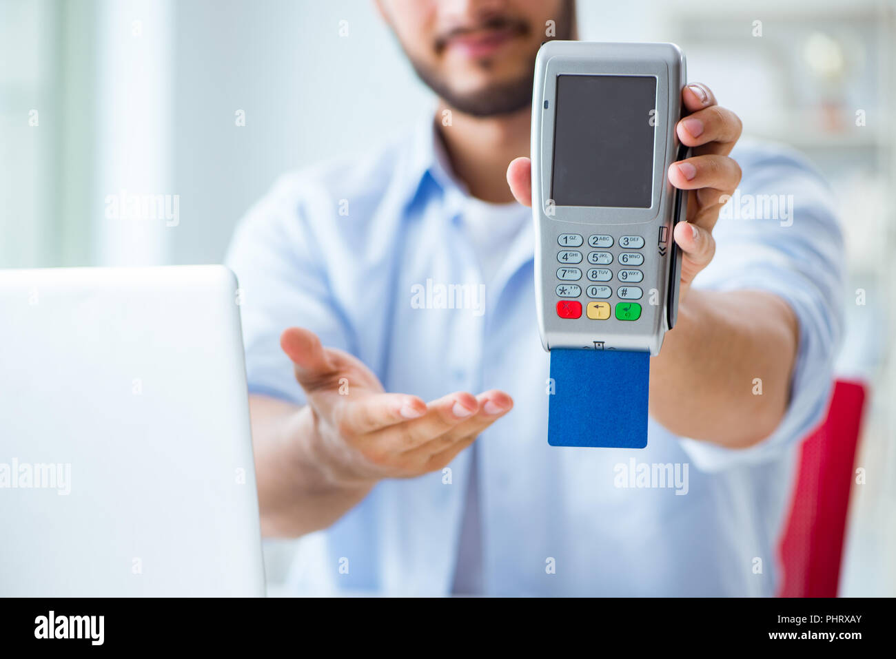 Man processing credit card transaction with POS terminal Stock Photo ...
