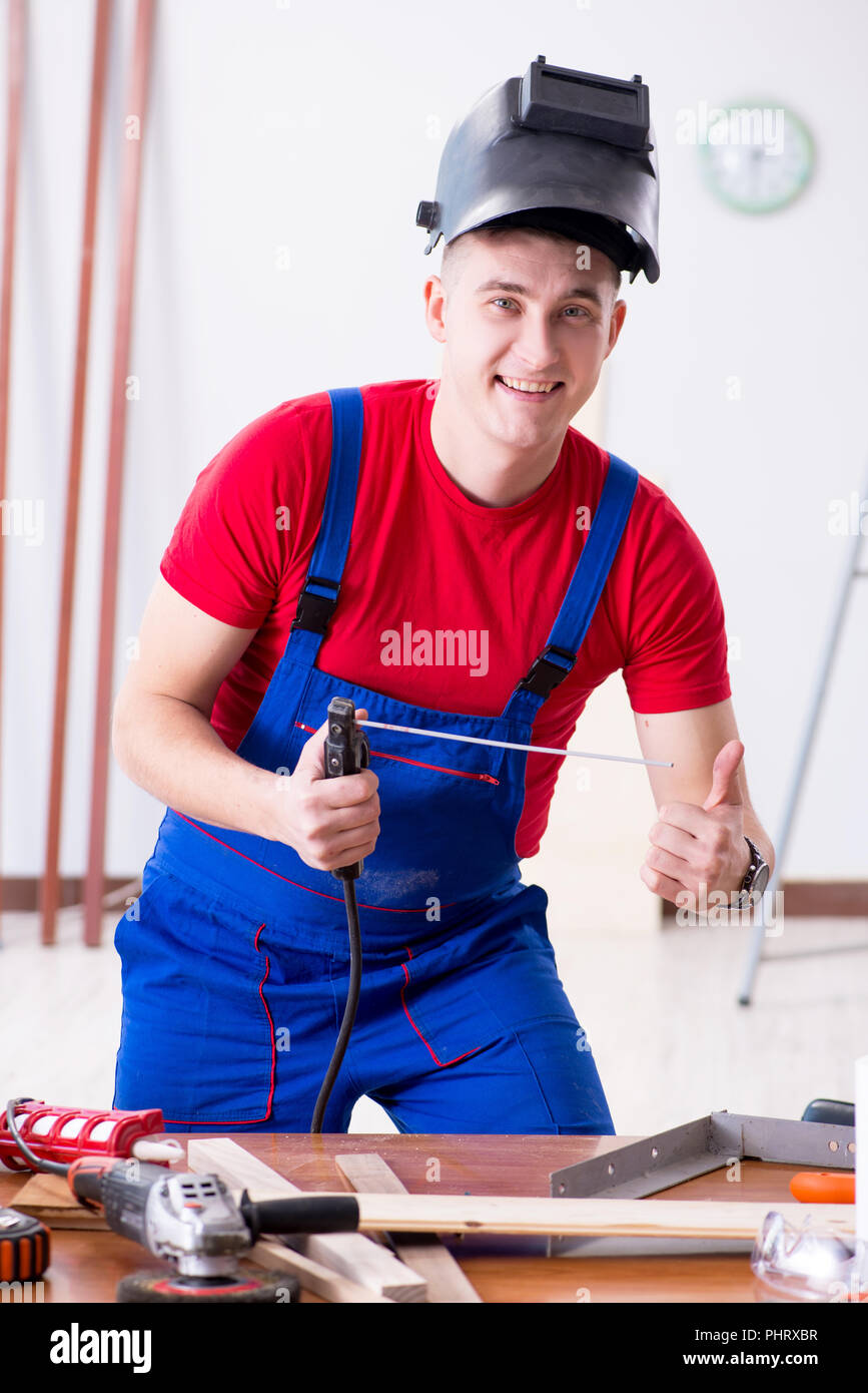 Contractor working in the workshop Stock Photo - Alamy