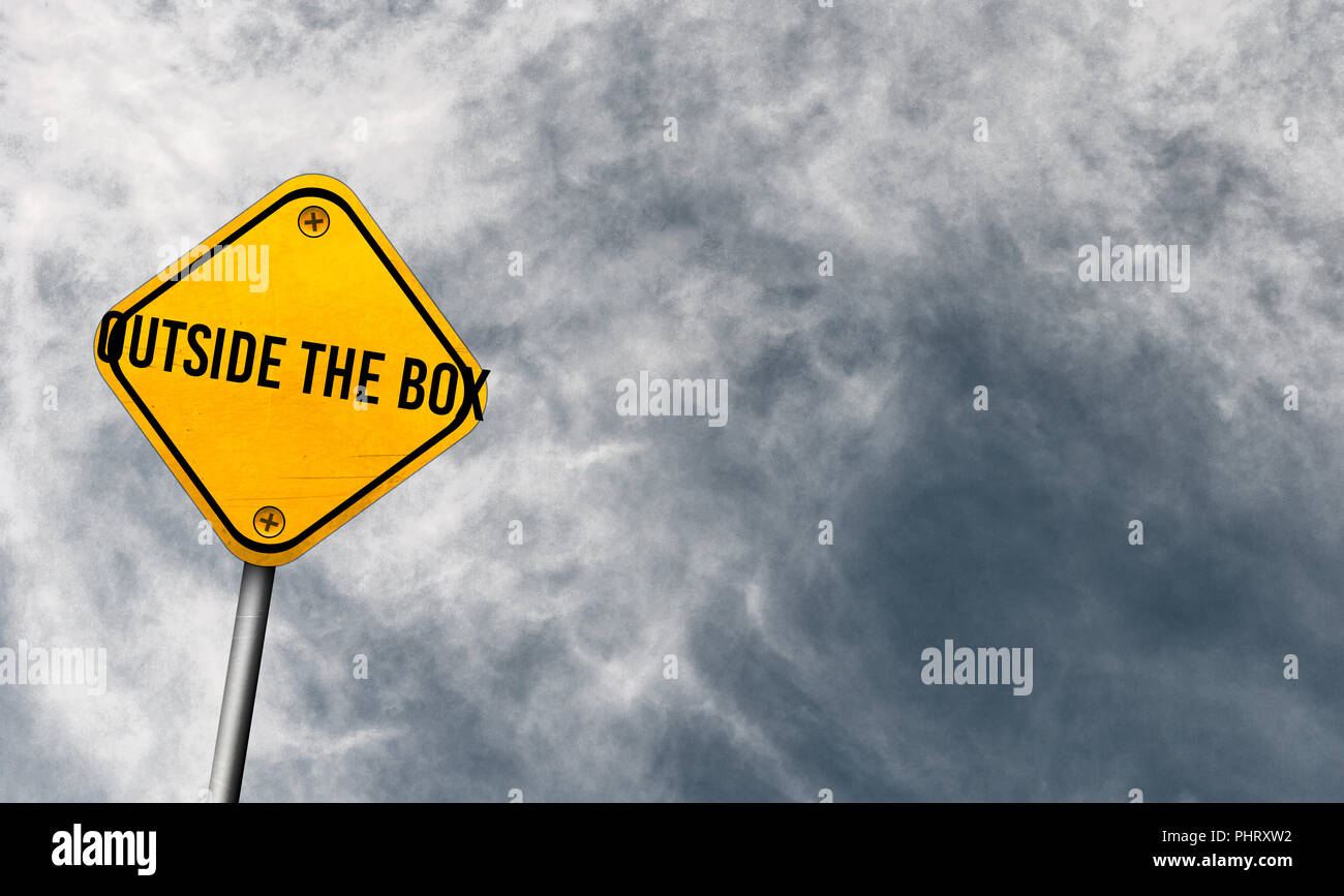 Outside the Box - yellow sign with cloudy sky Stock Photo - Alamy