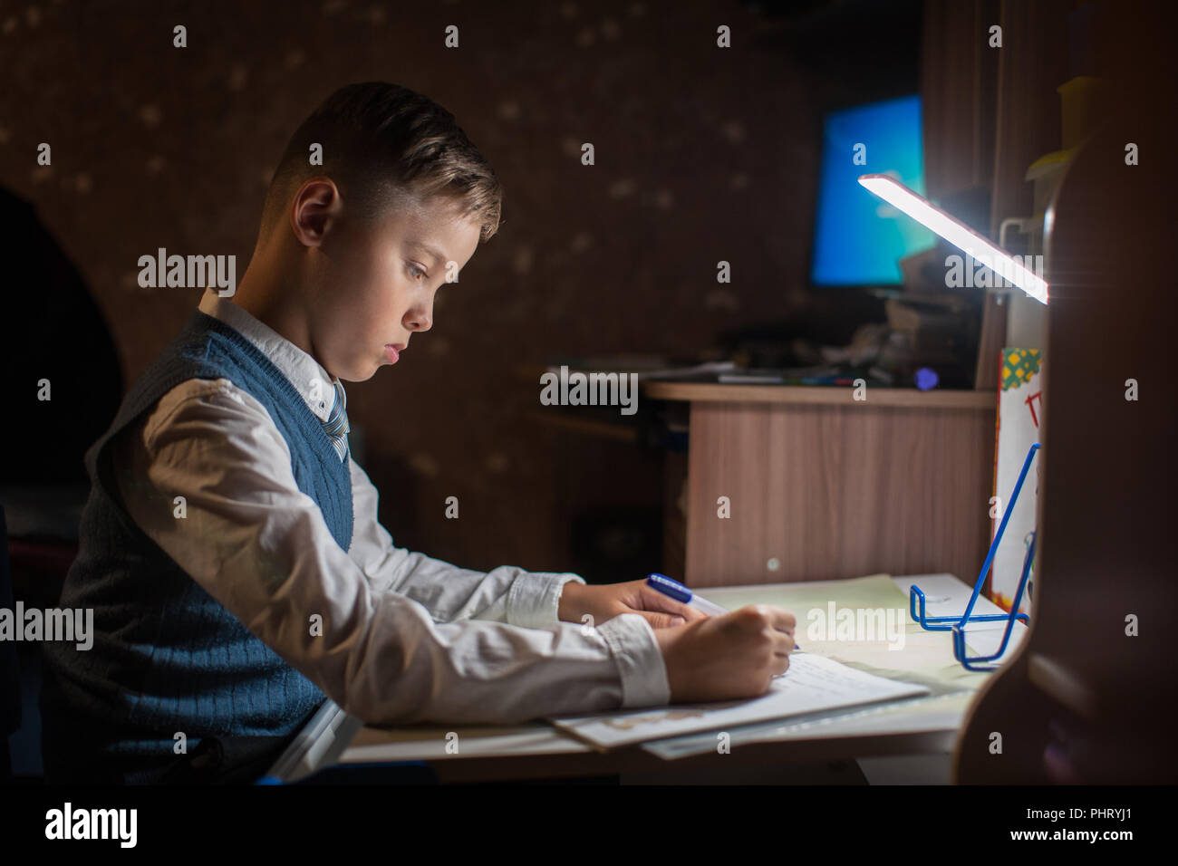 pupil boy does his homework Stock Photo - Alamy