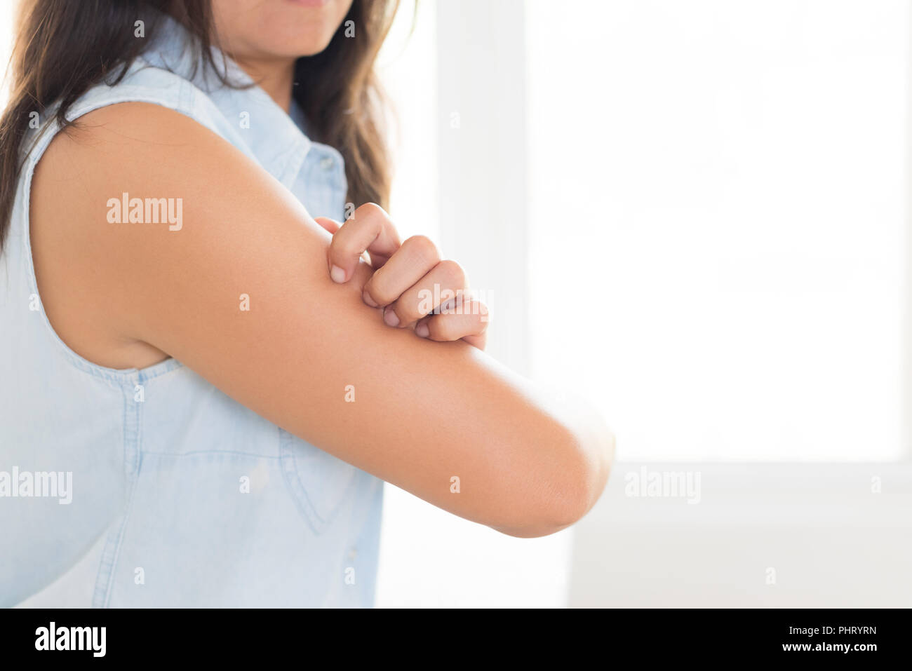Girl scratching arm hi-res stock photography and images - Alamy