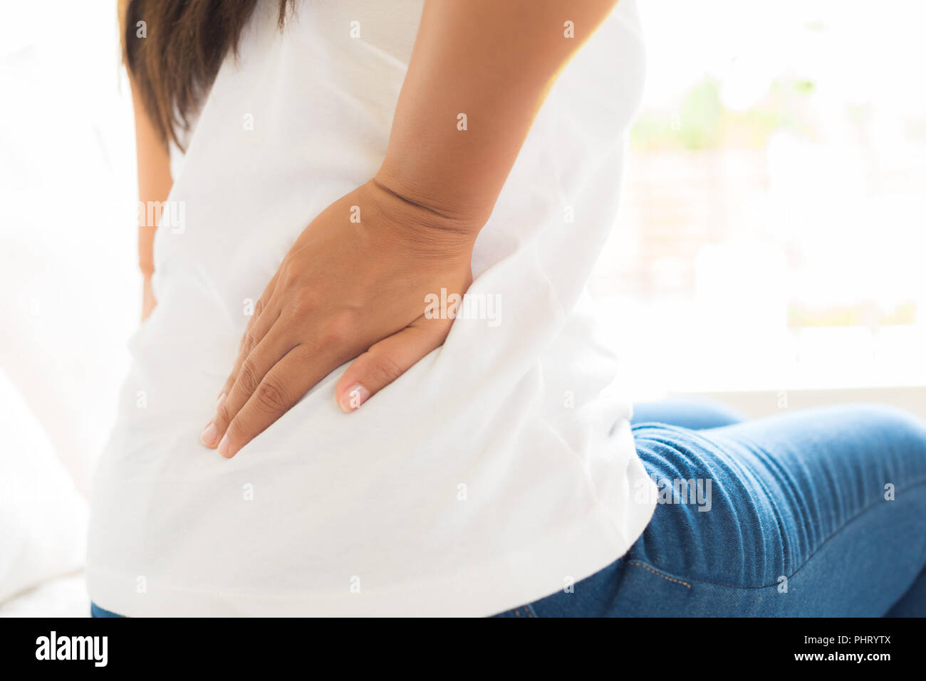 Close up woman having pain in injured back. Health care and back pain ...