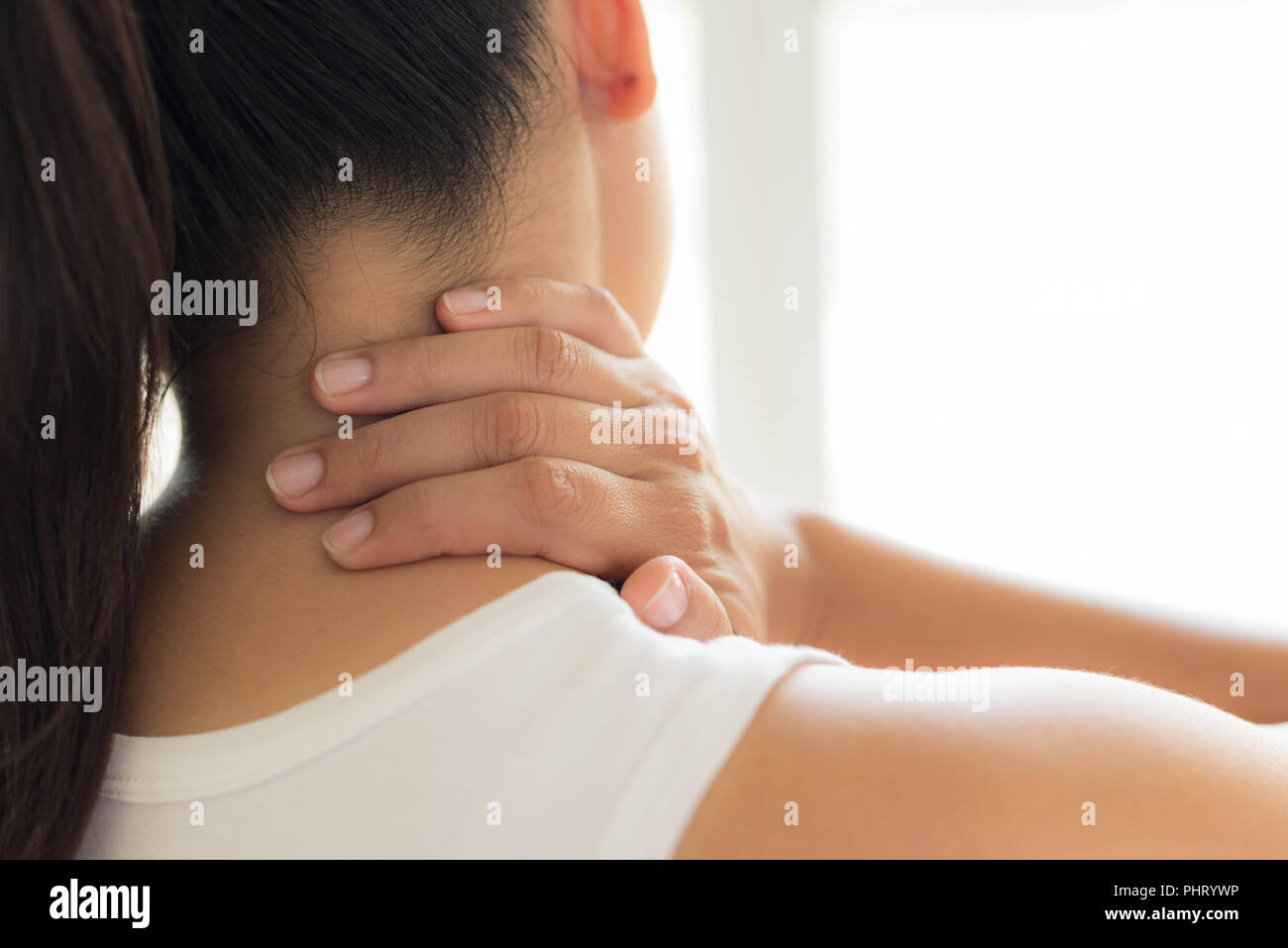 Closeup woman neck and shoulder pain and injury. Health care and ...