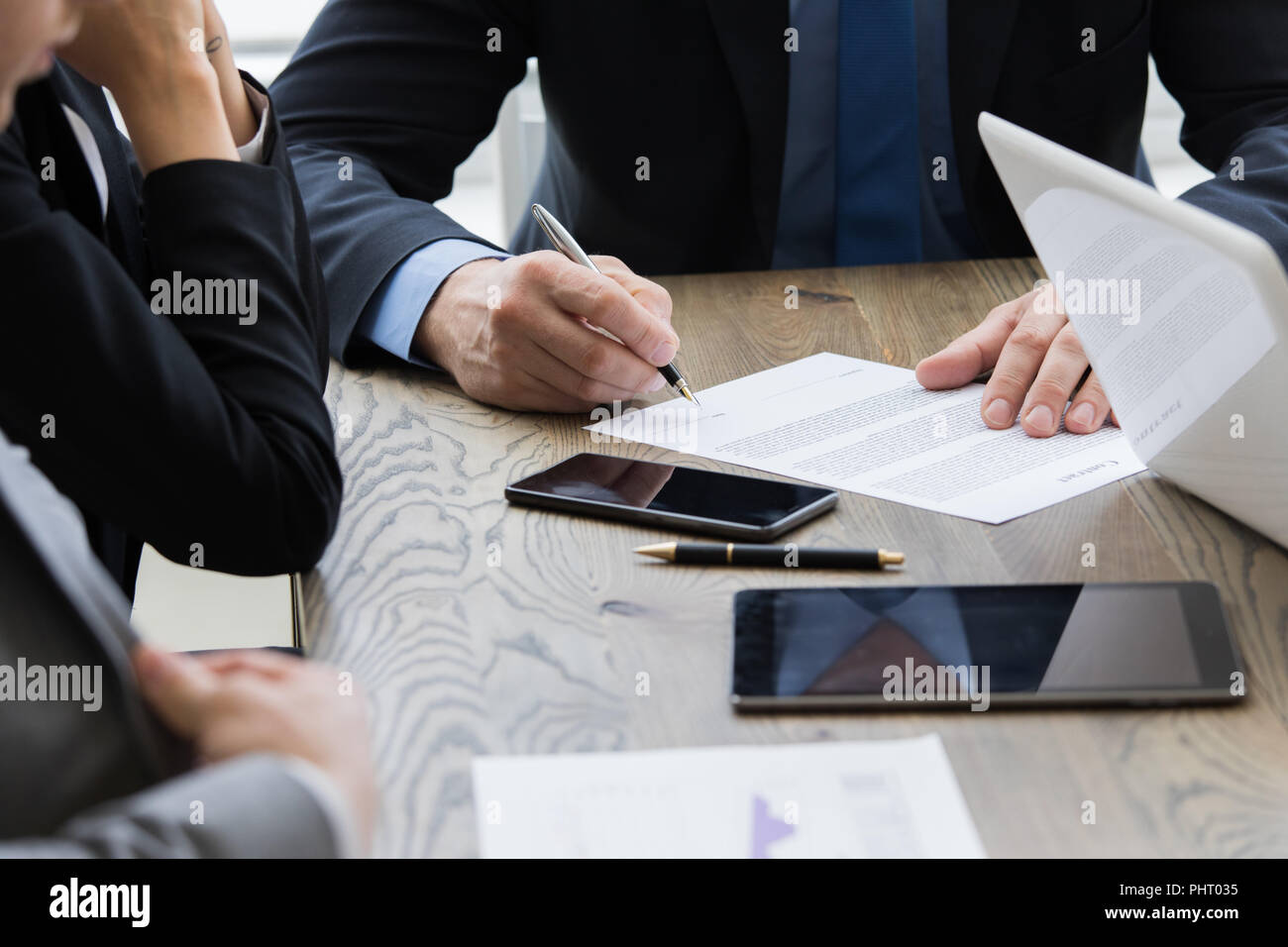 Business man sign contract on the desk at meeting Stock Photo - Alamy