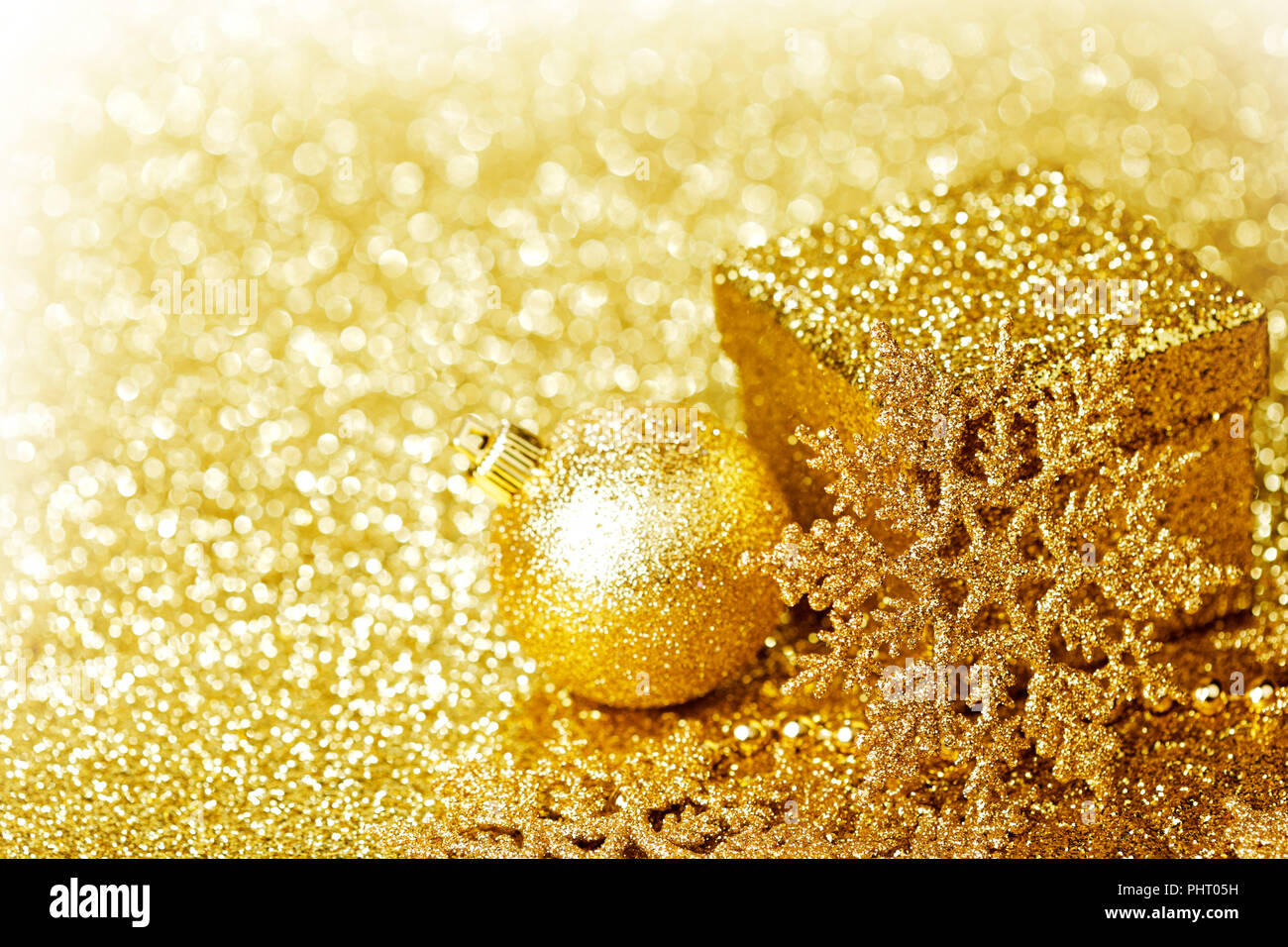 Shiny Golden christmas decor over glitter background Stock Photo - Alamy