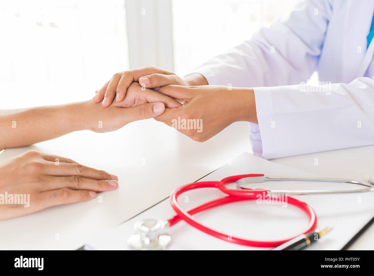 Doctor holding patient's hand. Medicine and health care concept. Doctor ...