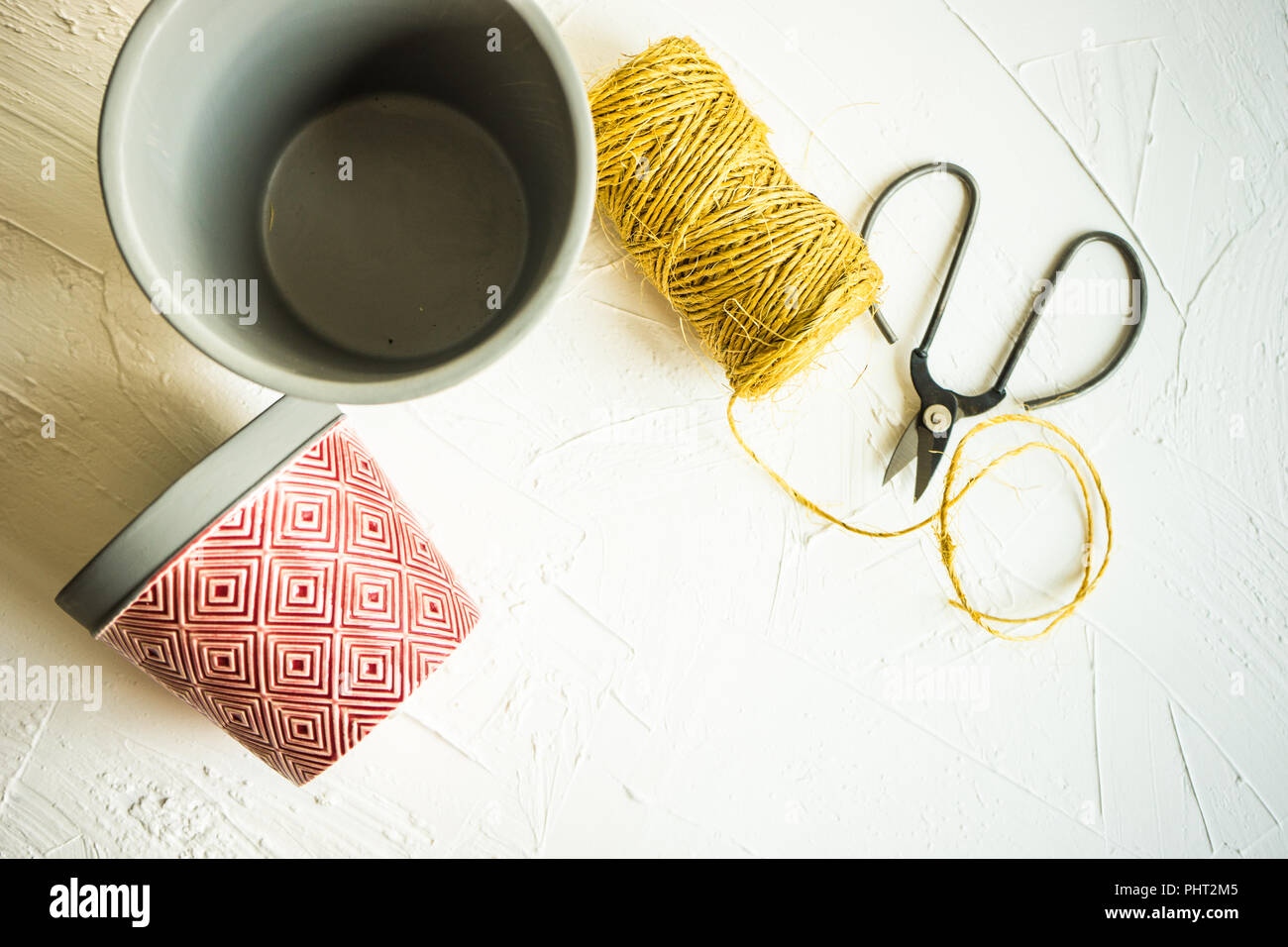 Gardening concept with empty flower pots on white concrete background ...