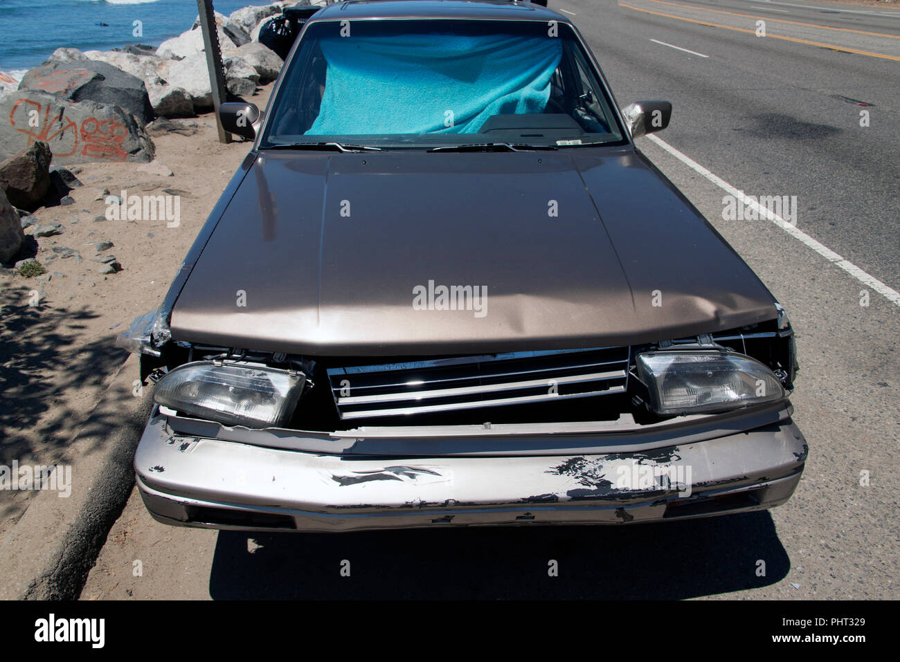 Front view of a crashed vintage car in the street in Malibu, California ...