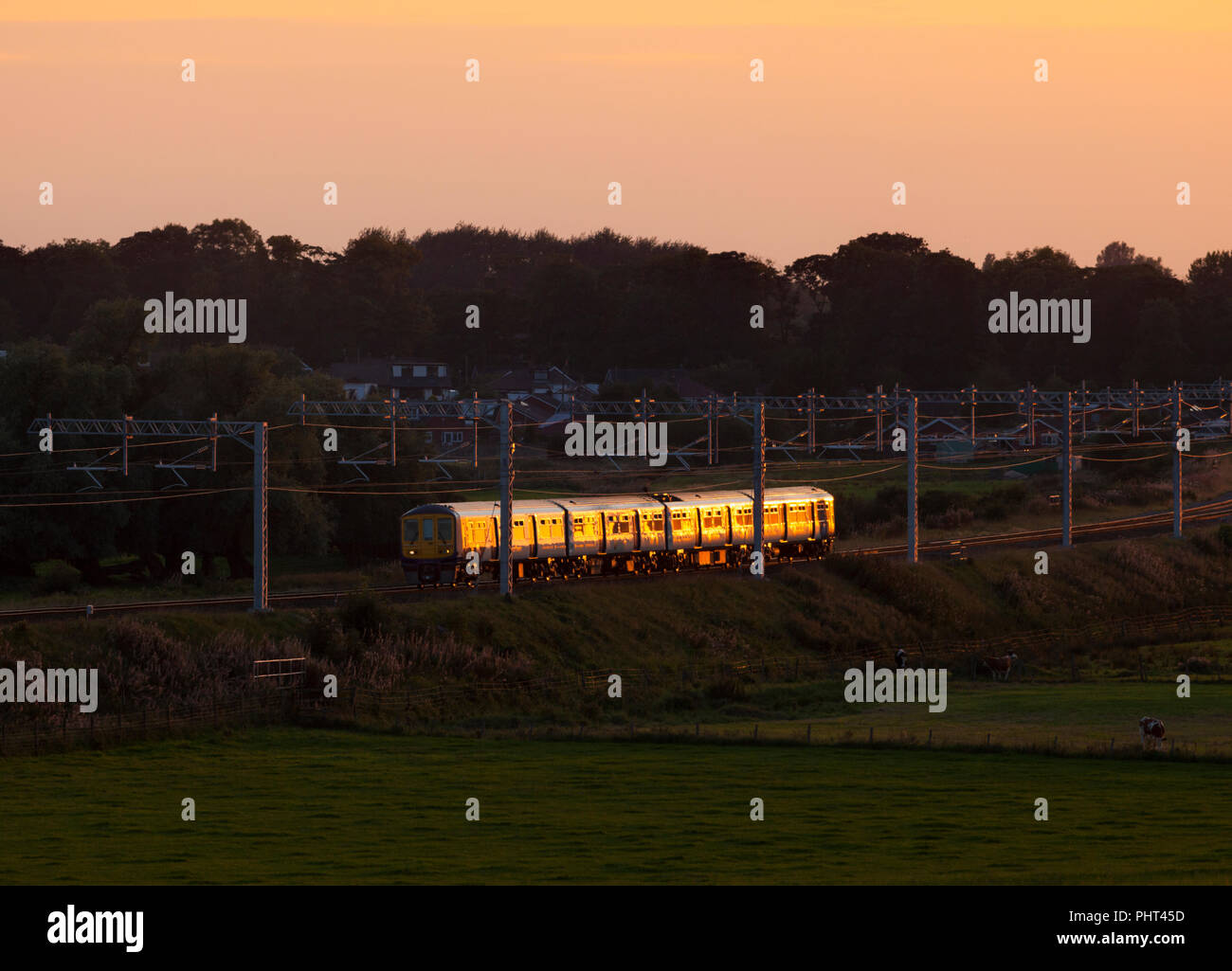 Northern rail class 319 electric train catching the sunset at Kirkham ...