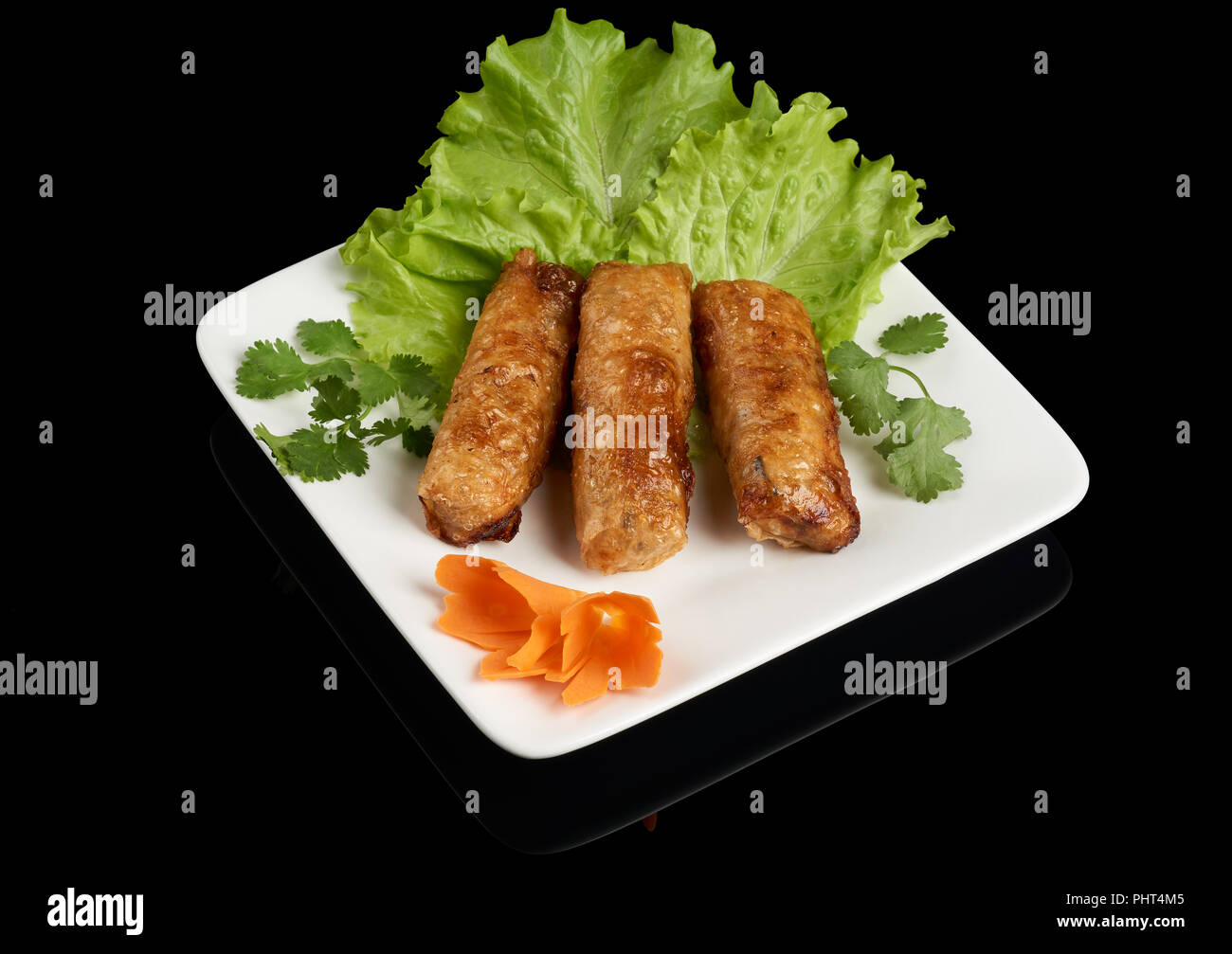 Vietnamese dish Nem crispy rolls with vegetables on rectangular white ...