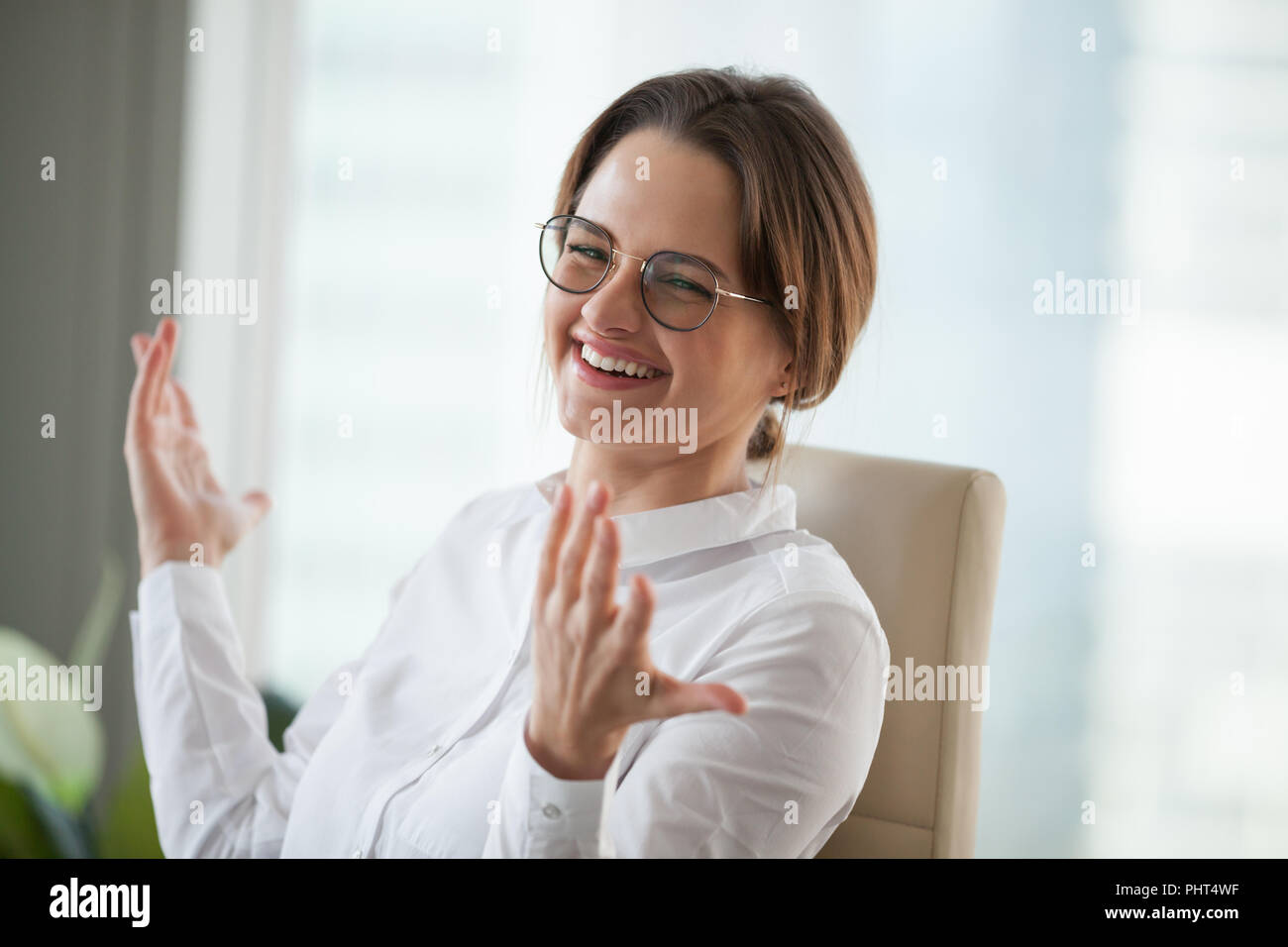 Happy businesswoman having fun laughing looking at camera in off Stock ...
