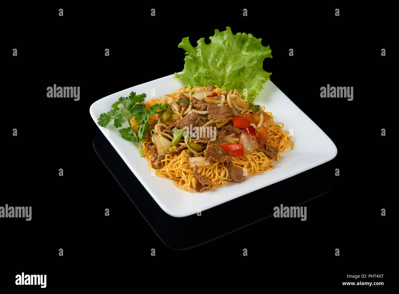 Mi Xao stir-fried noodles asian meals on triangle plate isolated on ...