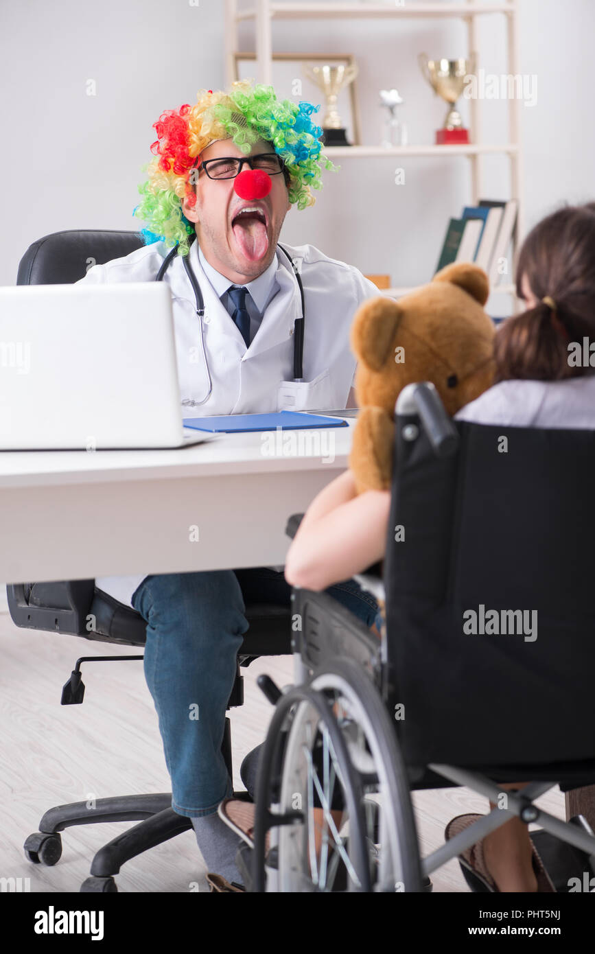 Funny pediatrician with little girl at regular check-up Stock Photo - Alamy