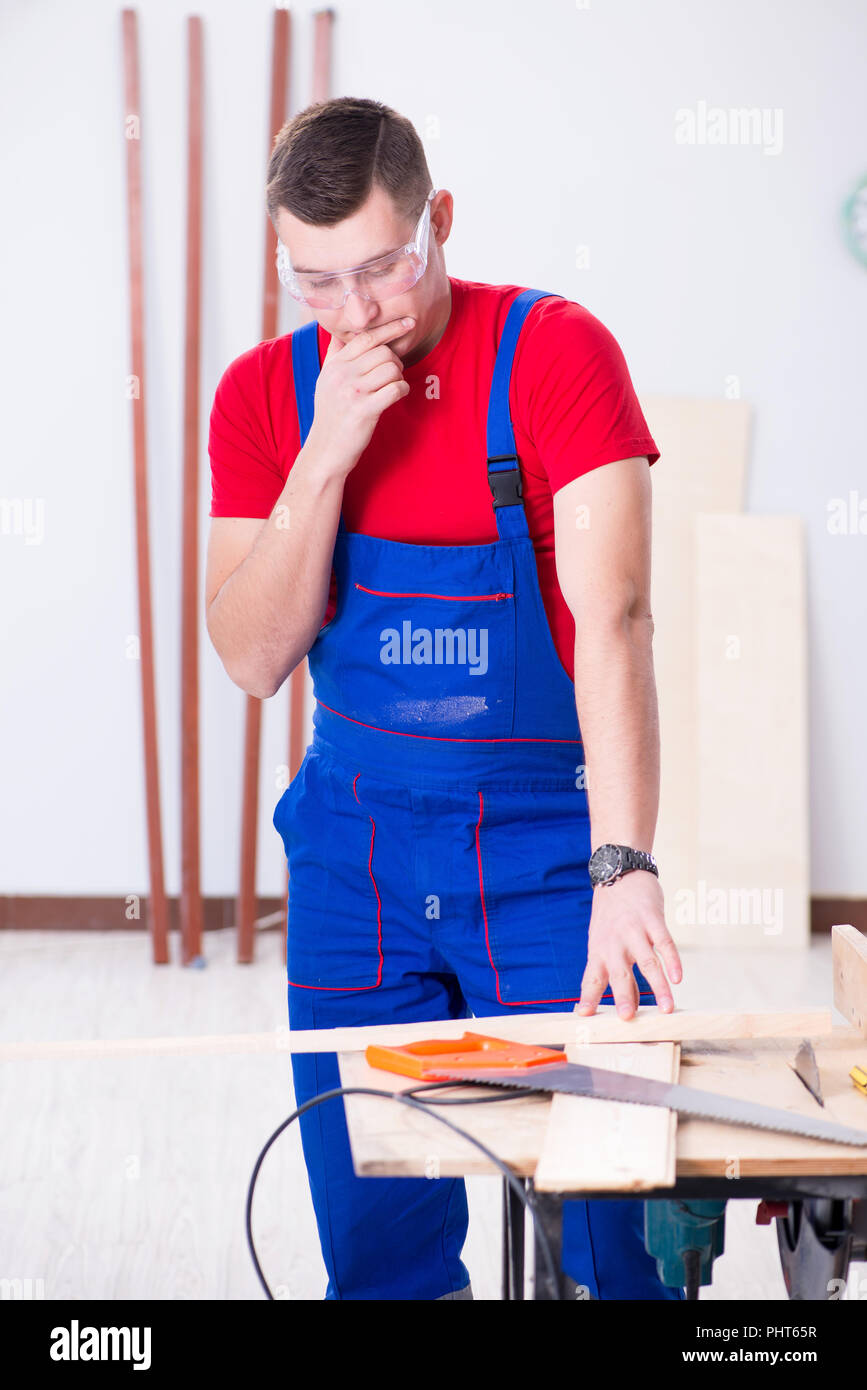 Contractor working in the workshop Stock Photo - Alamy