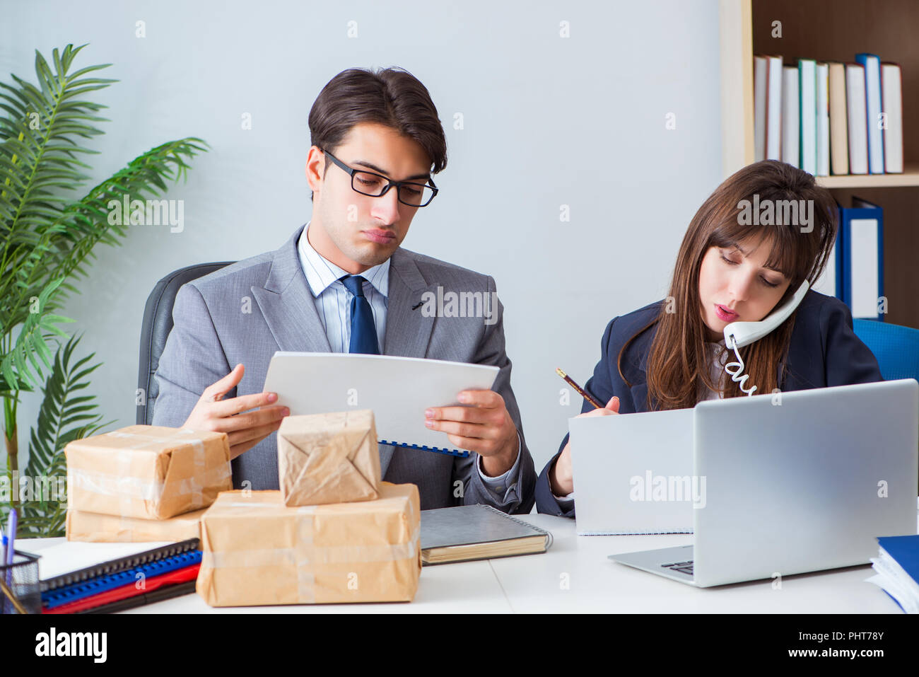 Business people receiving new mail and parcels Stock Photo - Alamy