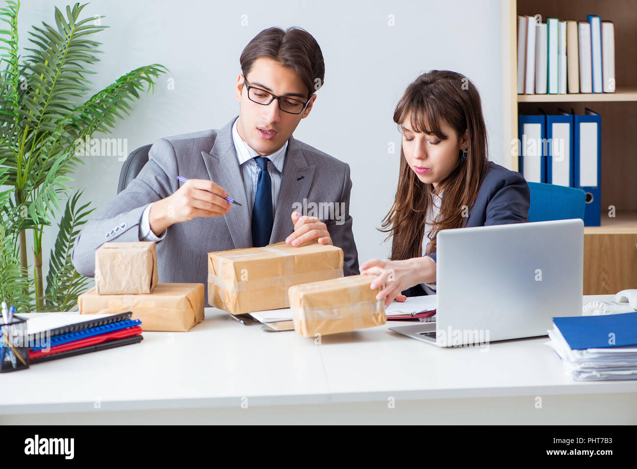 Business people receiving new mail and parcels Stock Photo - Alamy