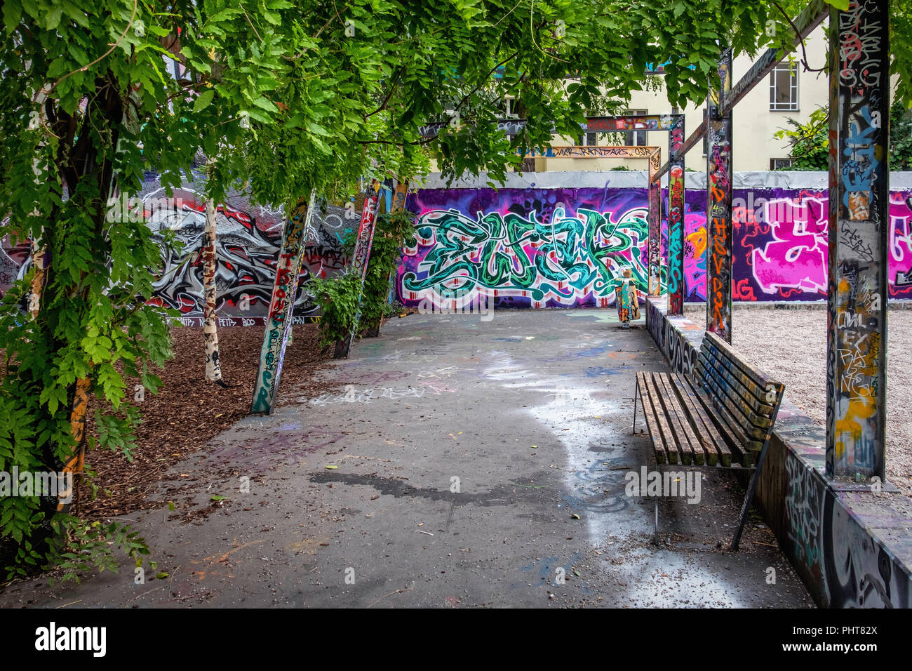 Berlin,Graffiti Corner, small park with birch trees,benches, trampoline ...