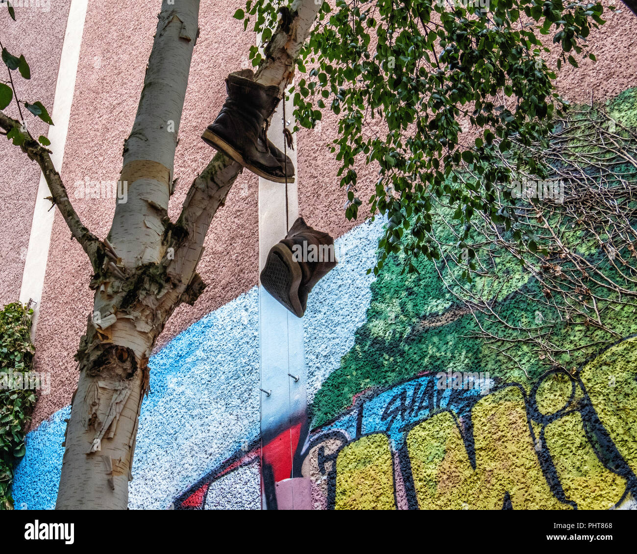 Berlin,Graffiti Corner, small park with birch trees,benches, trampoline ...