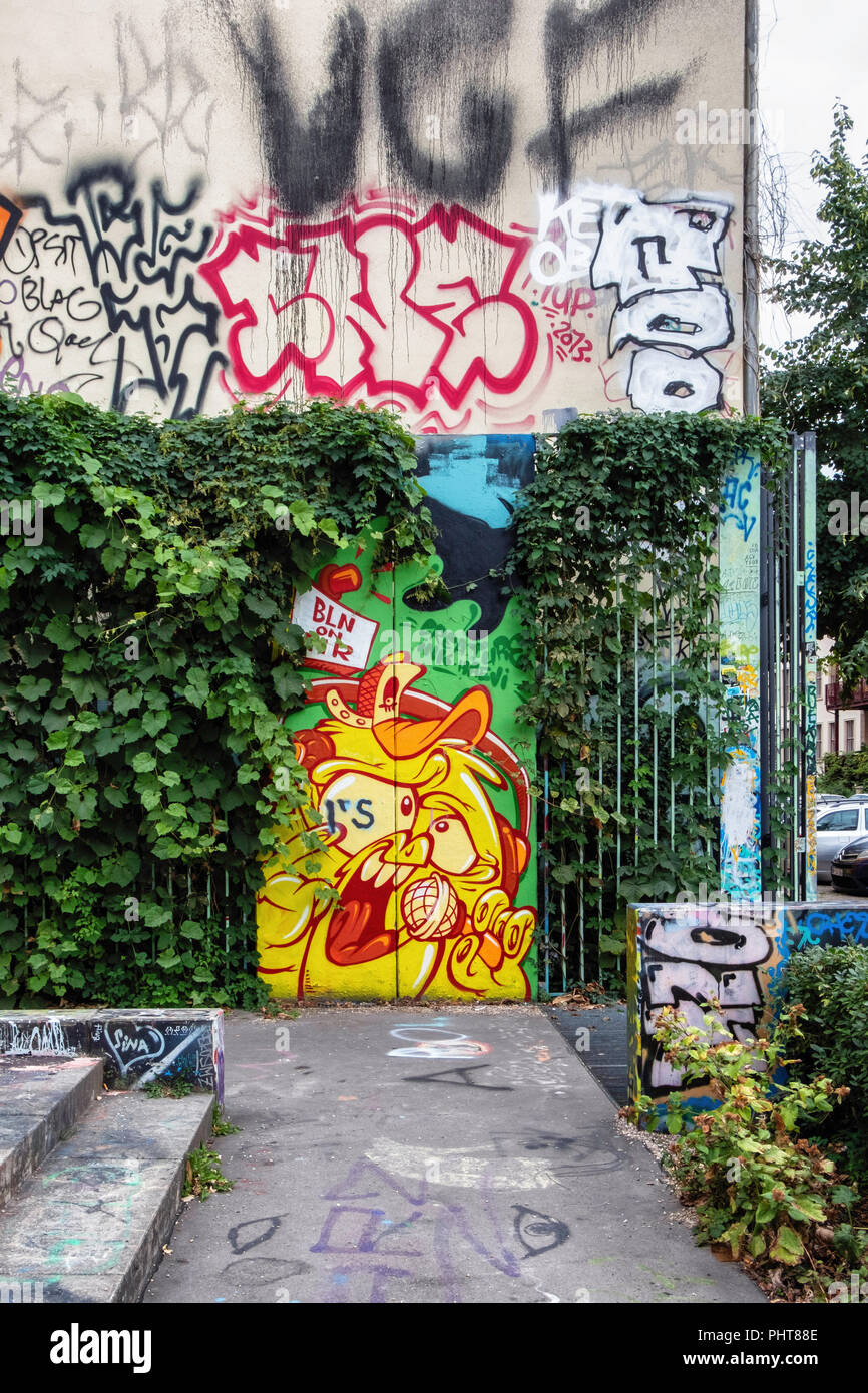 Berlin,Graffiti Corner, small park with birch trees,benches, trampoline ...