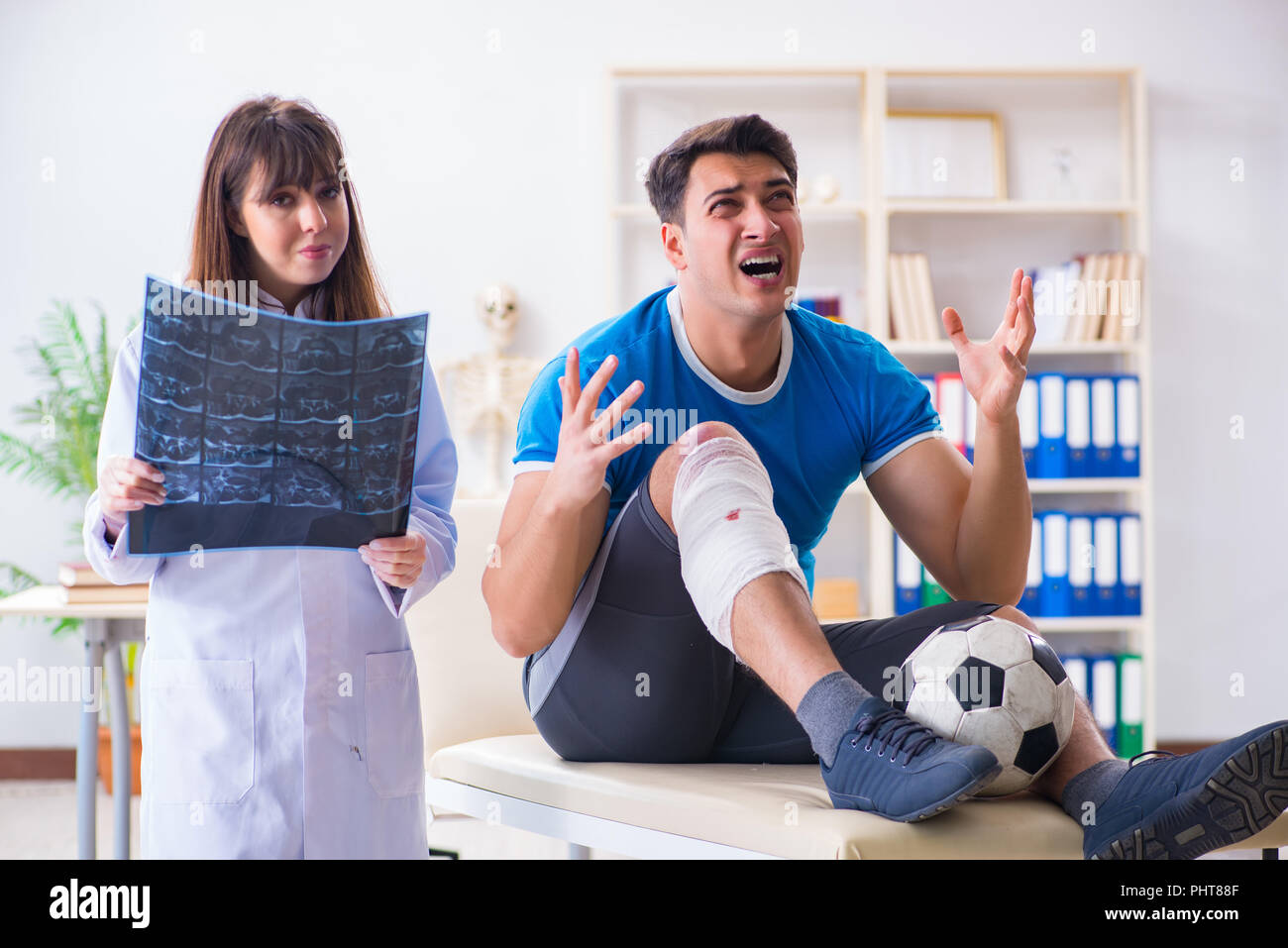 Football soccer player visiting doctor after injury Stock Photo - Alamy