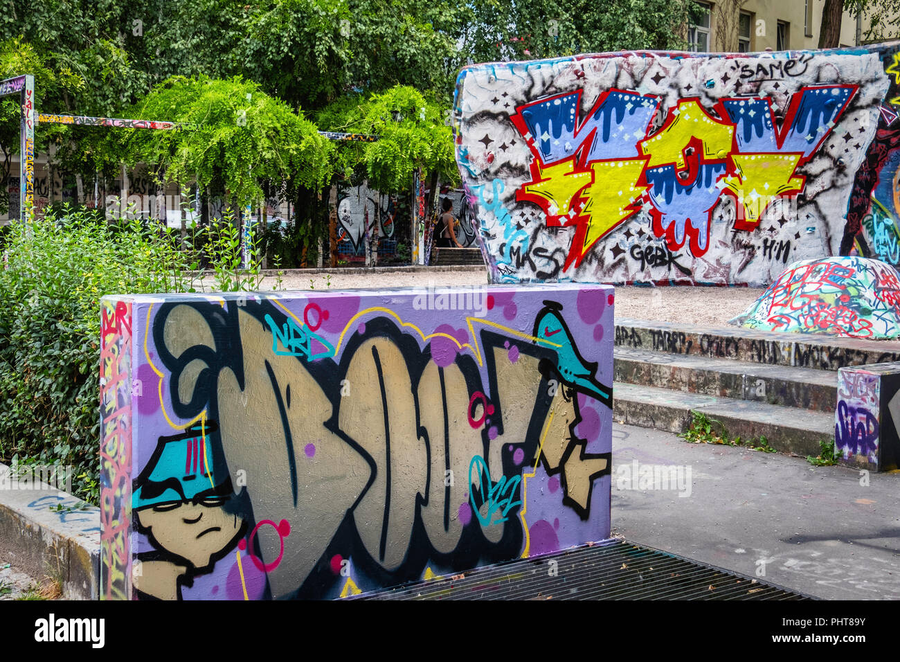 Berlin,Graffiti Corner, small park with birch trees,benches, trampoline ...