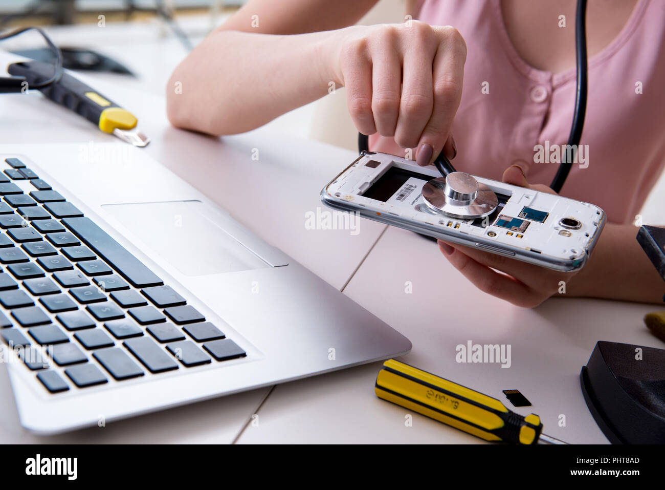 Mobile phone repair in workshop Stock Photo - Alamy