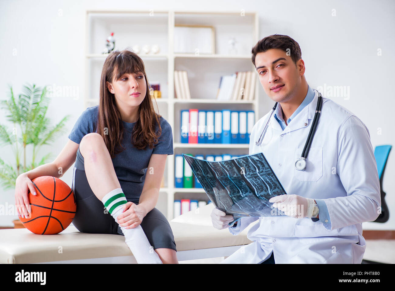Female basketball player visiting doctor after injury Stock Photo - Alamy
