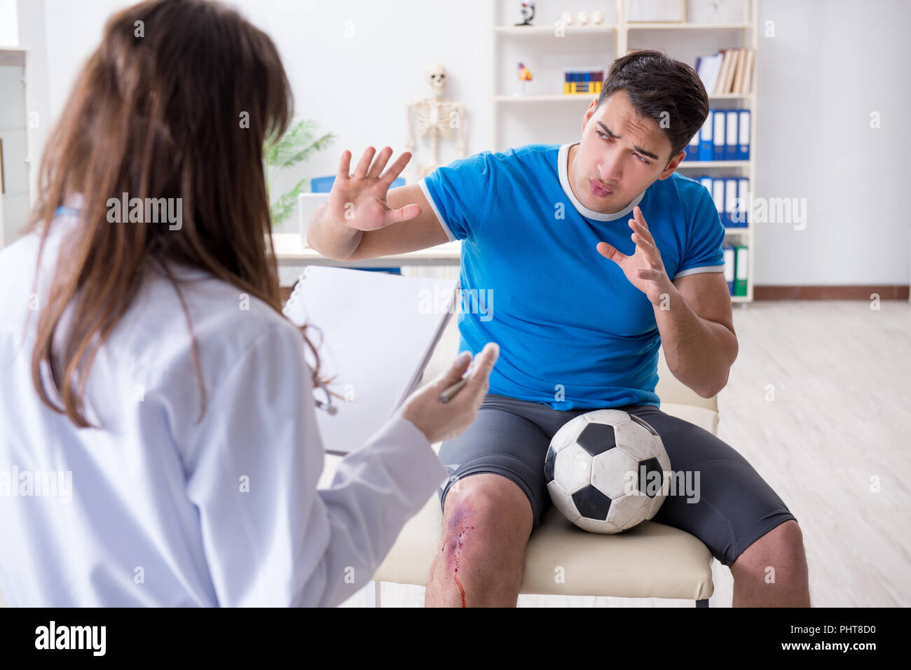 Football soccer player visiting doctor after injury Stock Photo - Alamy