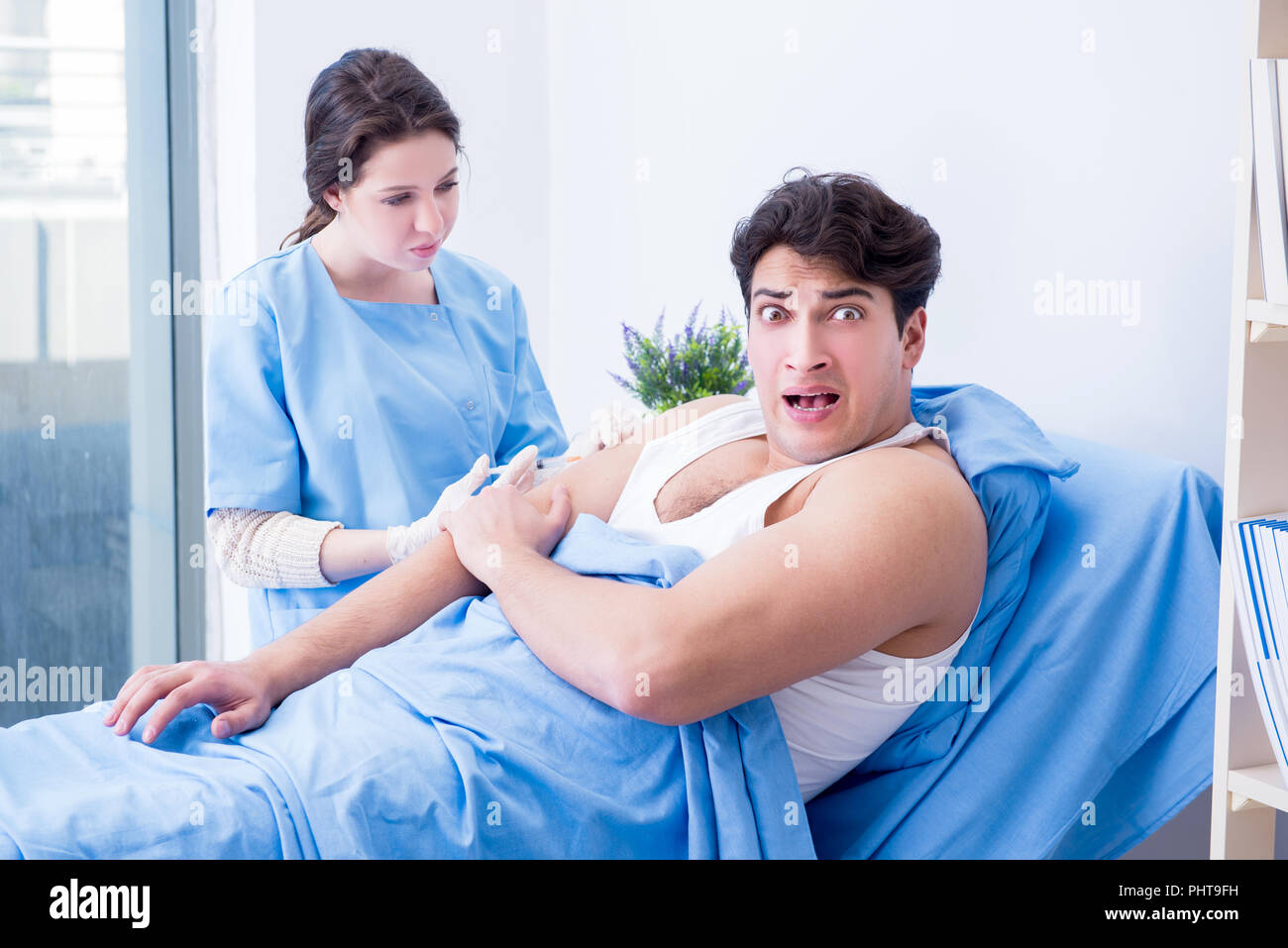 Doctor doing medical injection in hospital room Stock Photo - Alamy